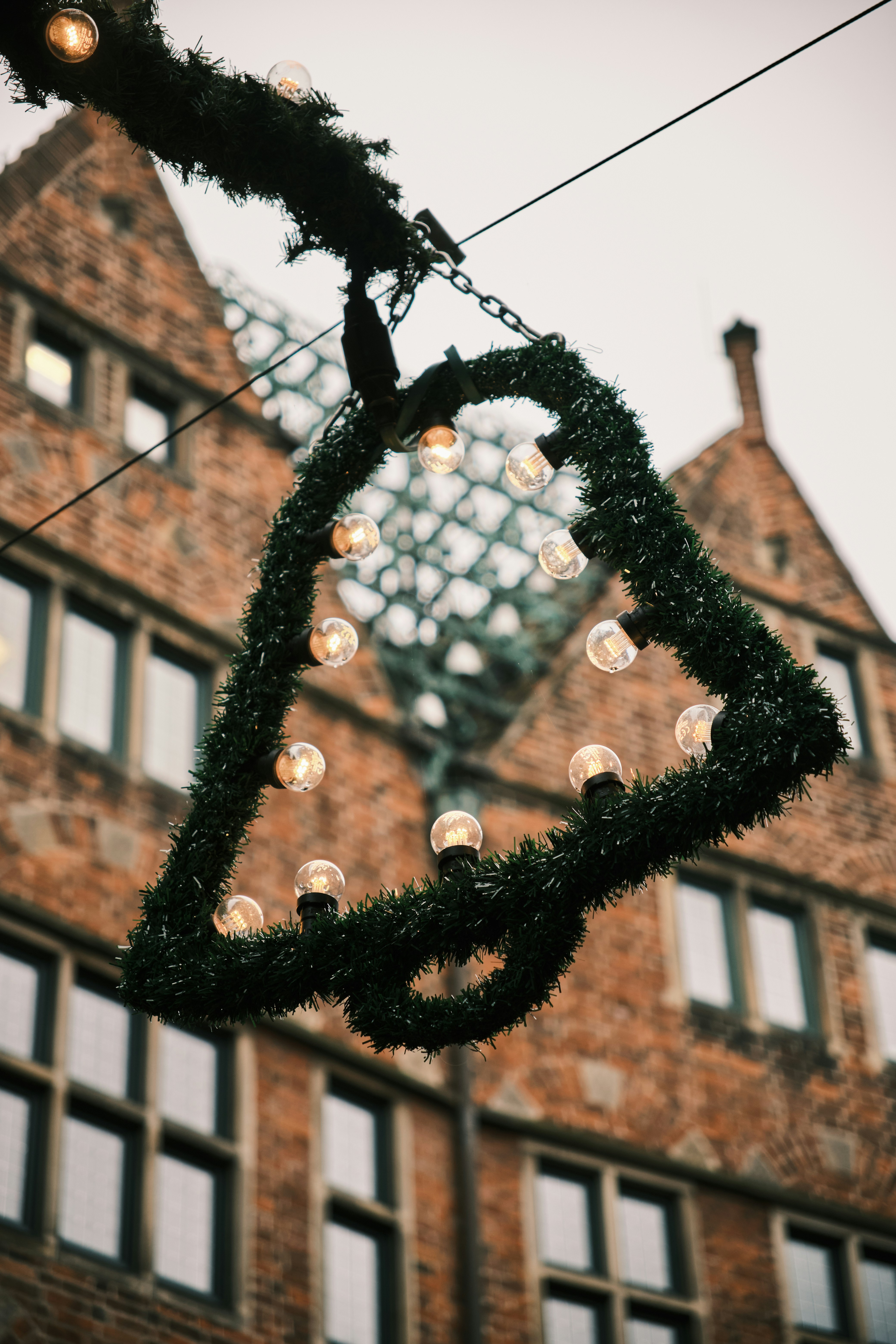 Twinkling Holiday Charm: A Festive Bell Adorned with Lights