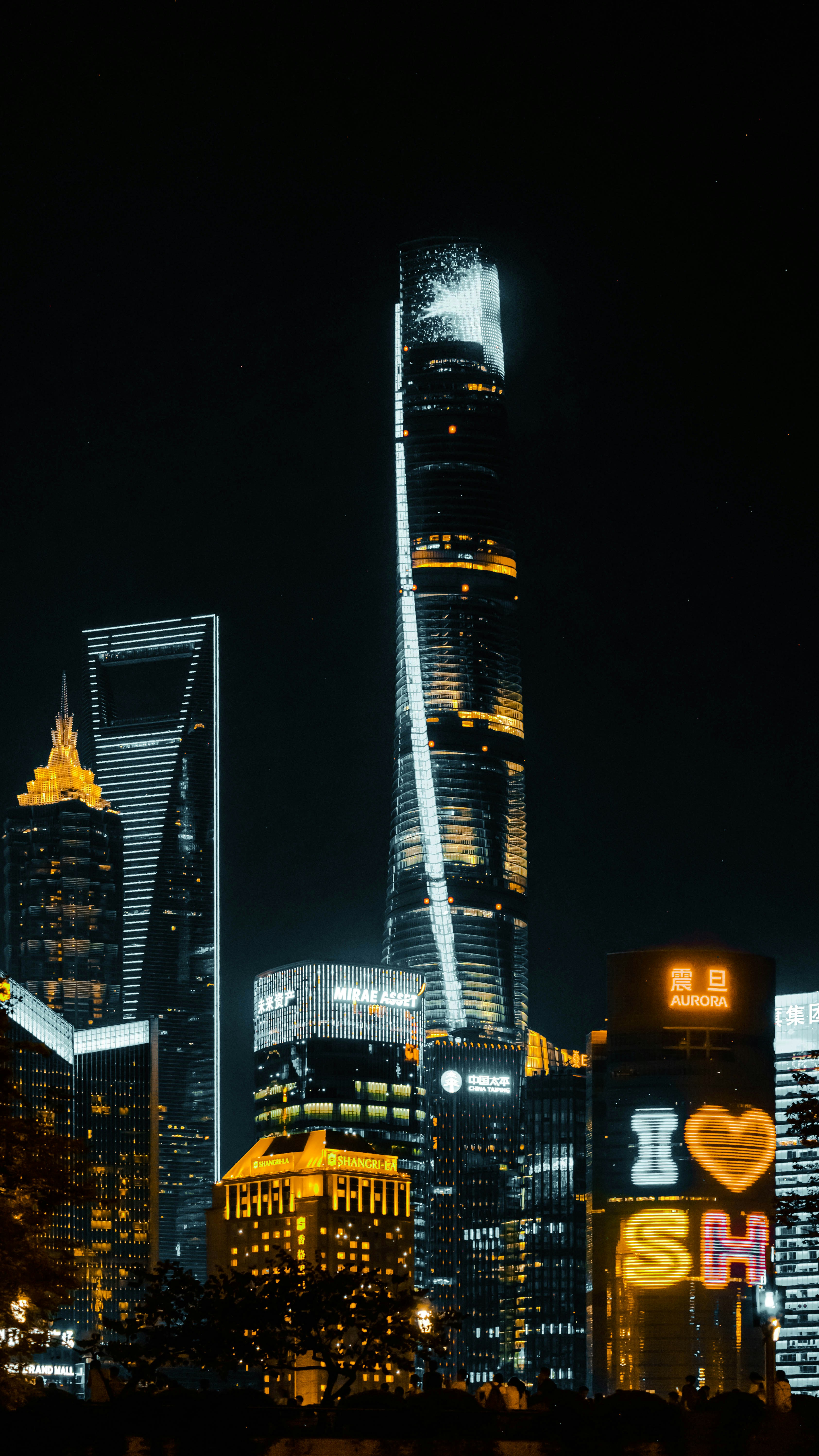 Bright city skyline with illuminated skyscrapers at night