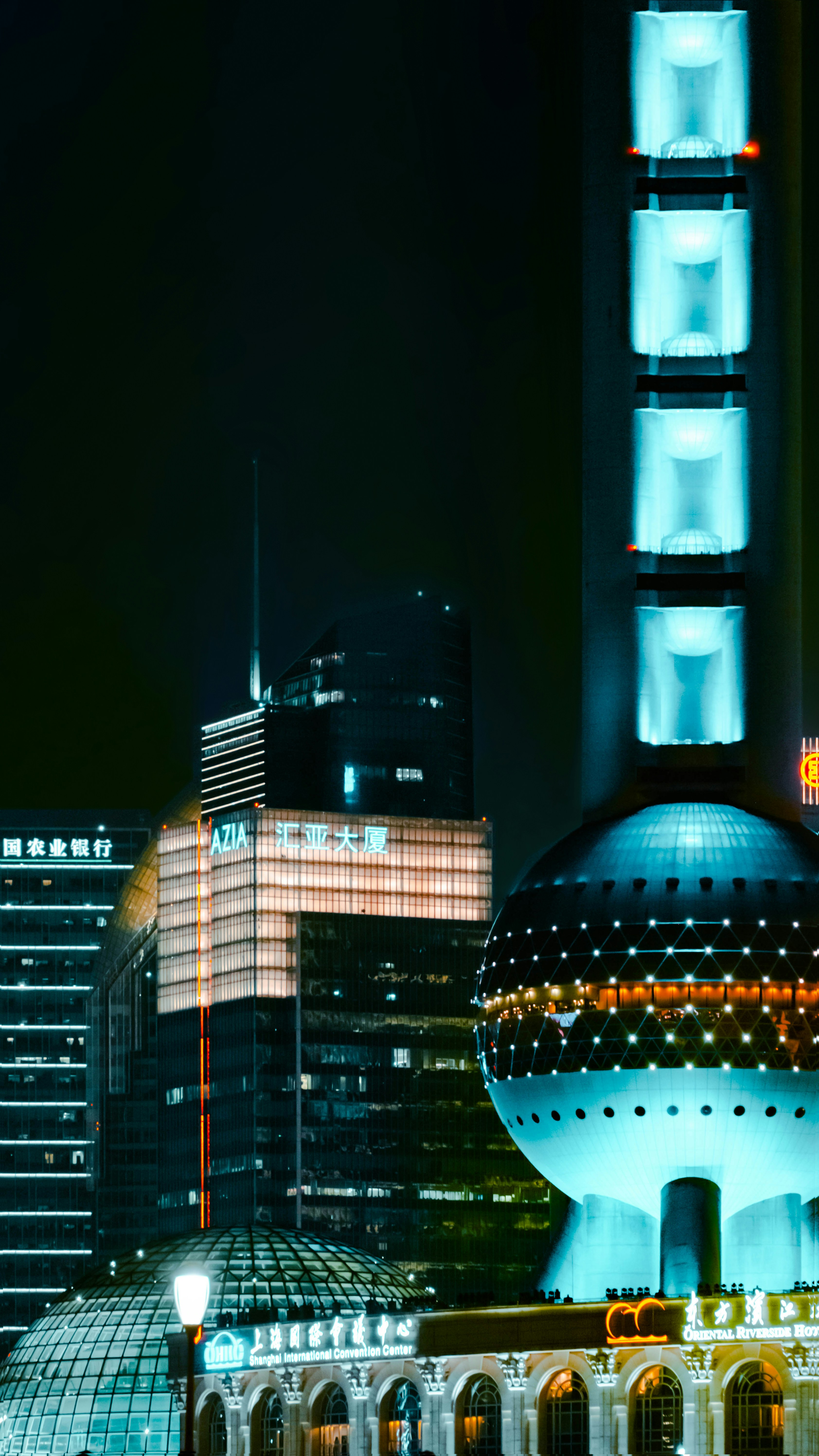 Modern skyscrapers illuminated at night with blue lights. photo – Free ...