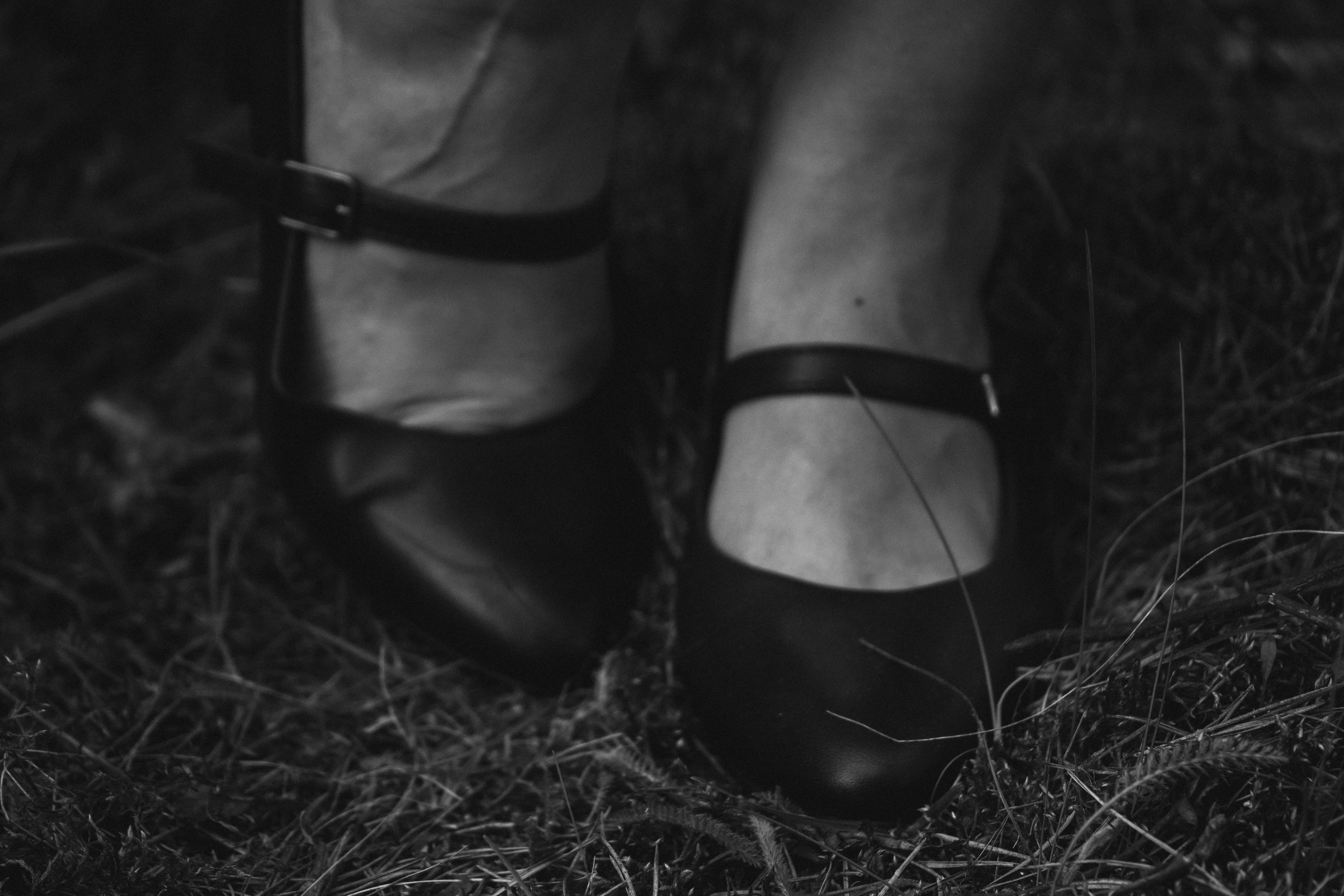Black mary jane shoes on grass