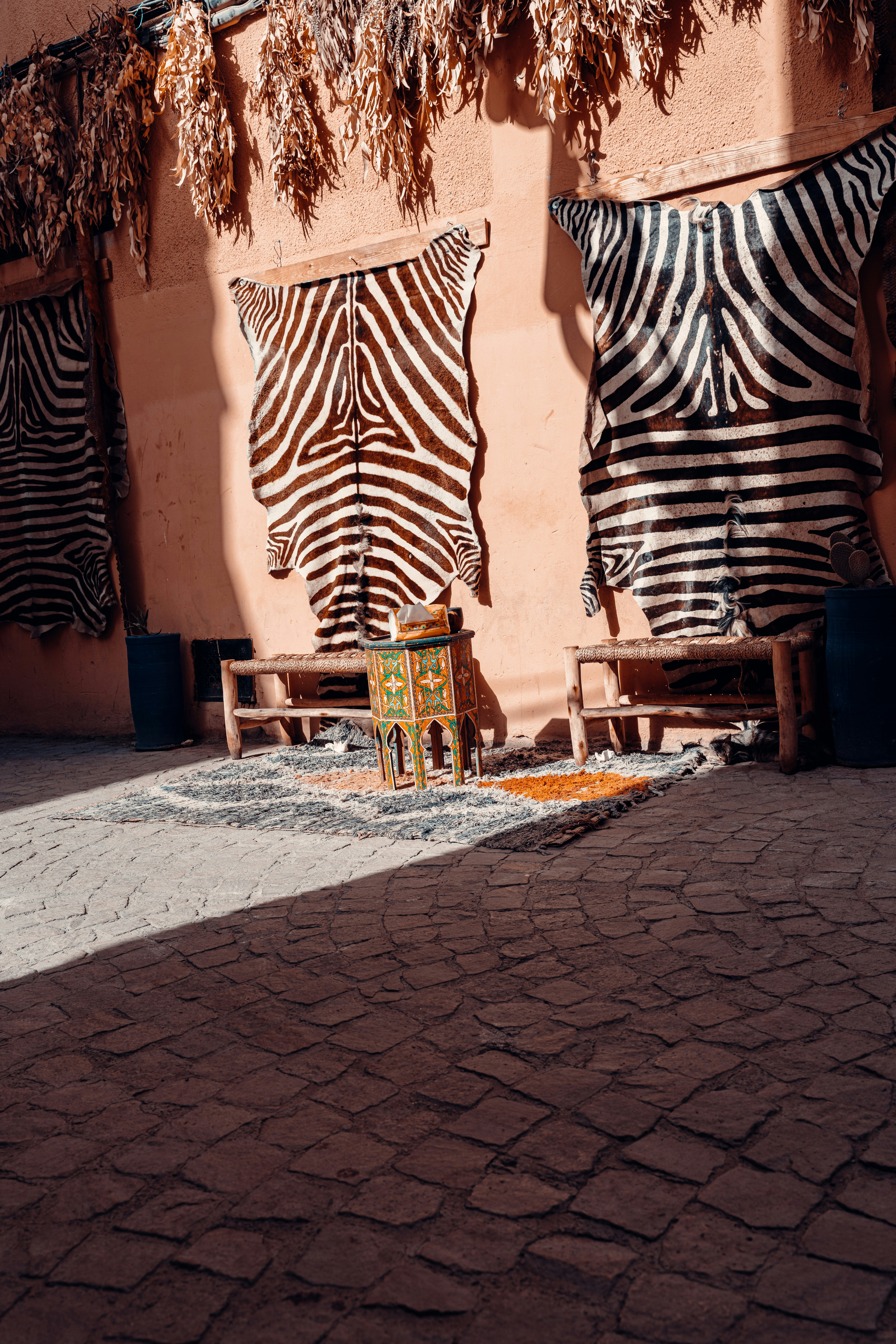 Zebra hides displayed outside a building