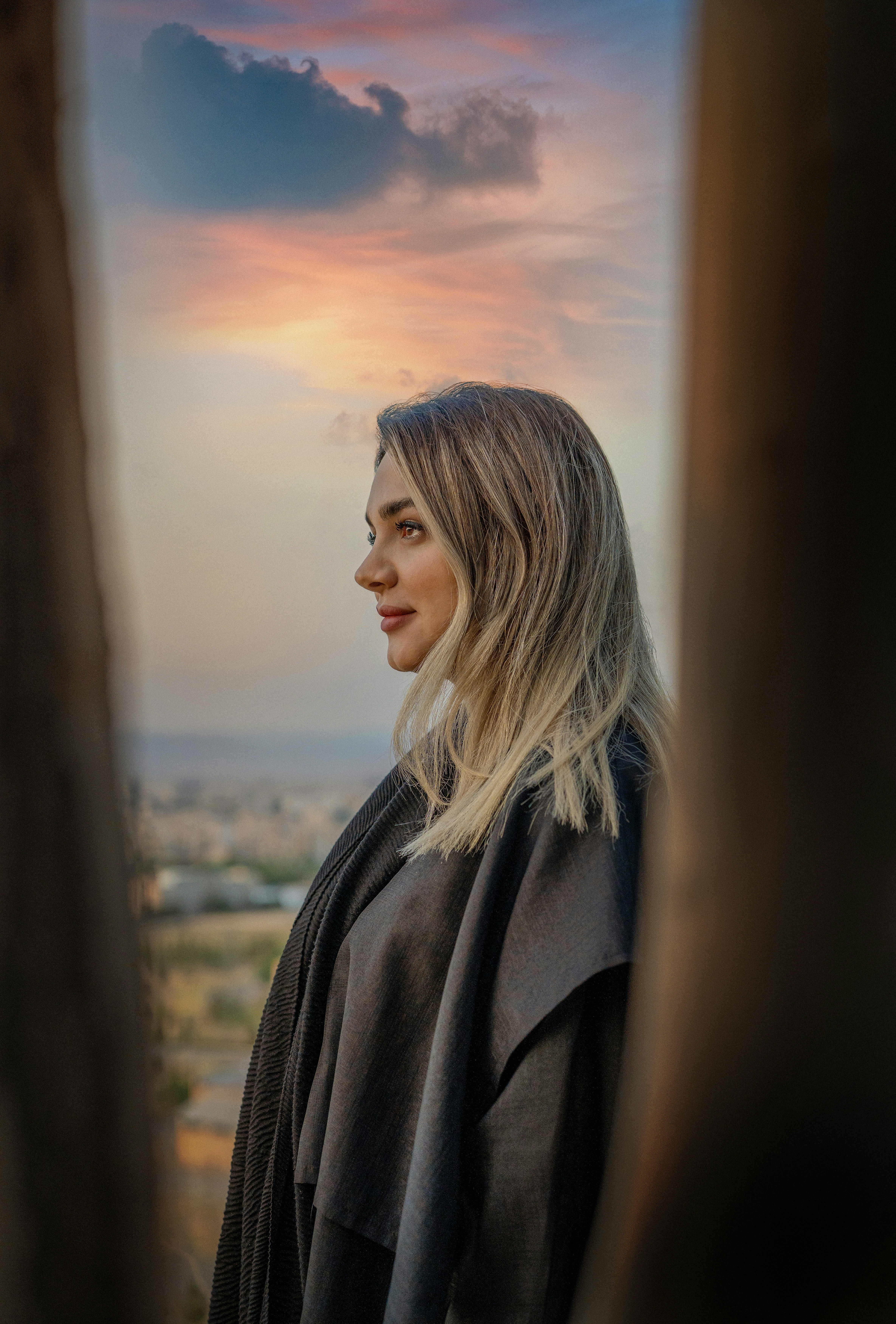 Young woman looking at sunset sky