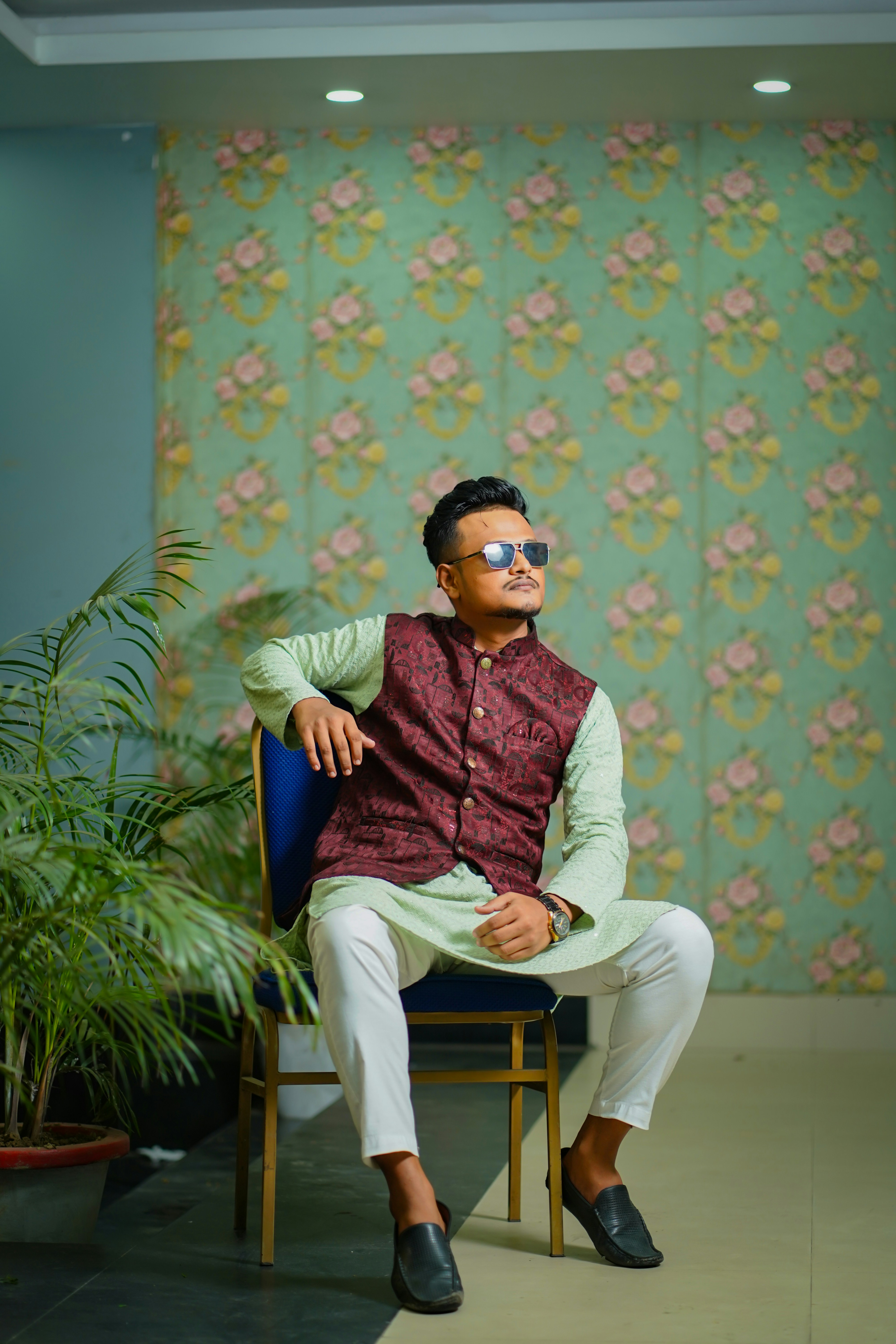 Sleek Confidence: A Gentleman at Rest in Patterned Light