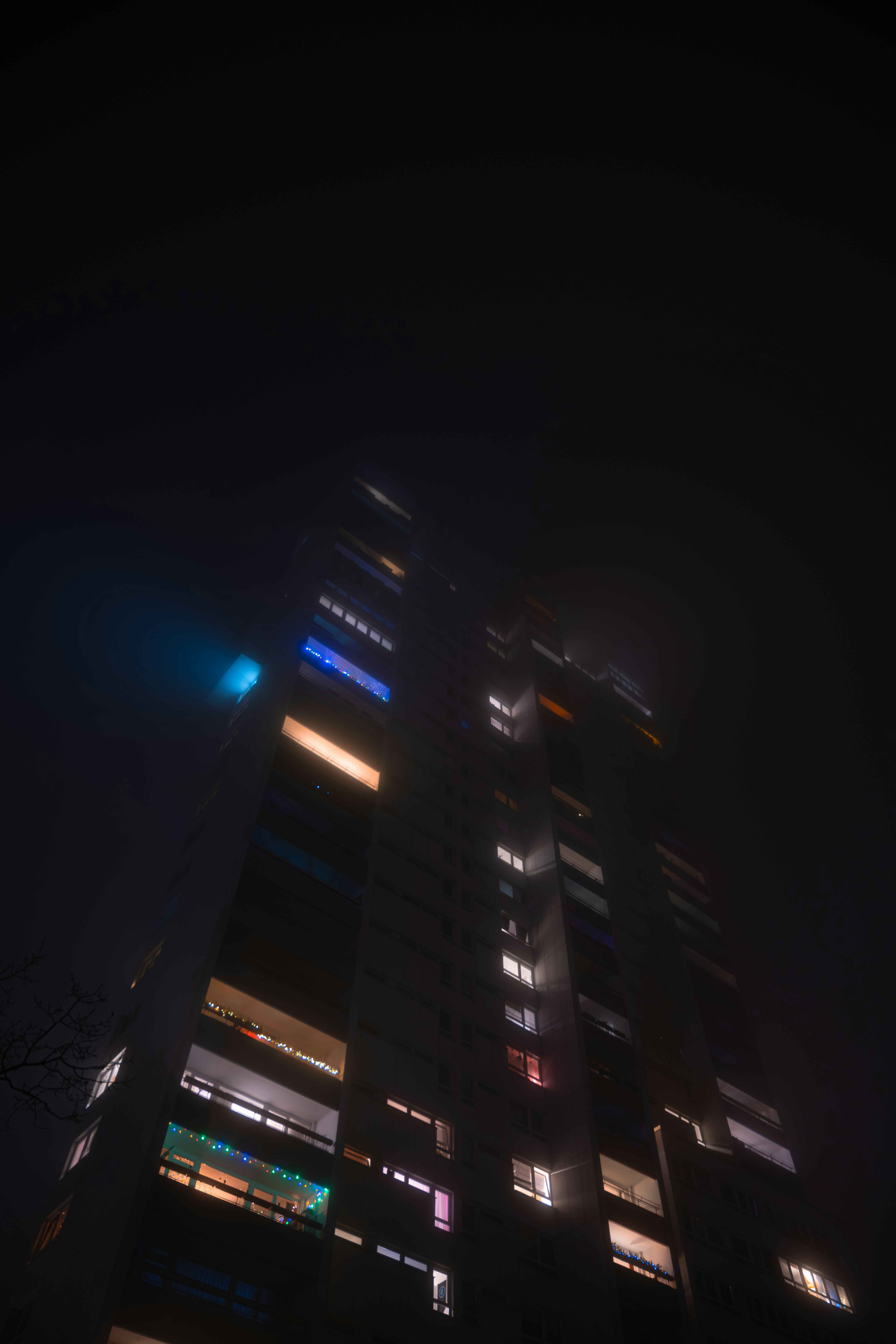 Tall building with illuminated windows at night