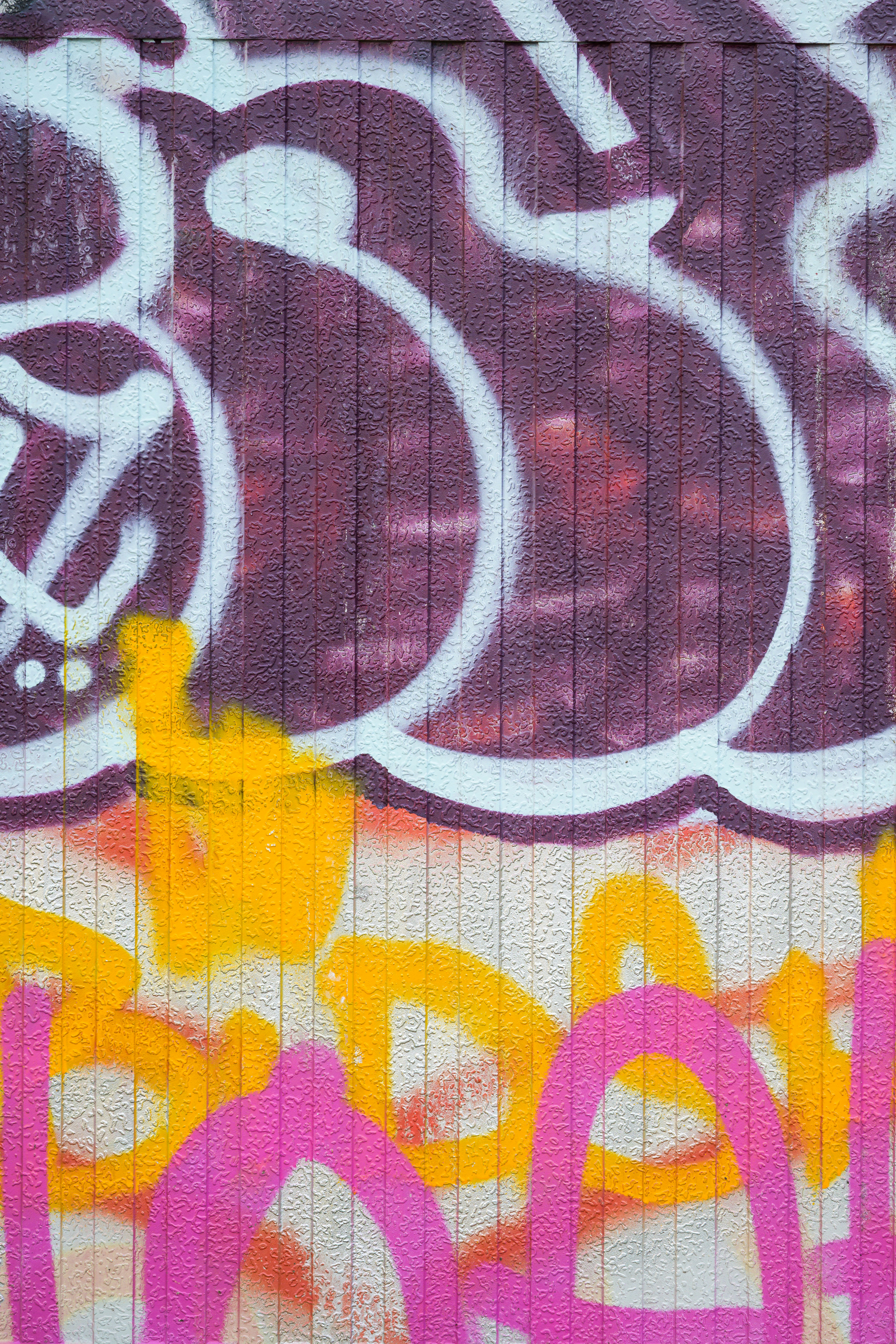 Colorful graffiti art on a textured wall