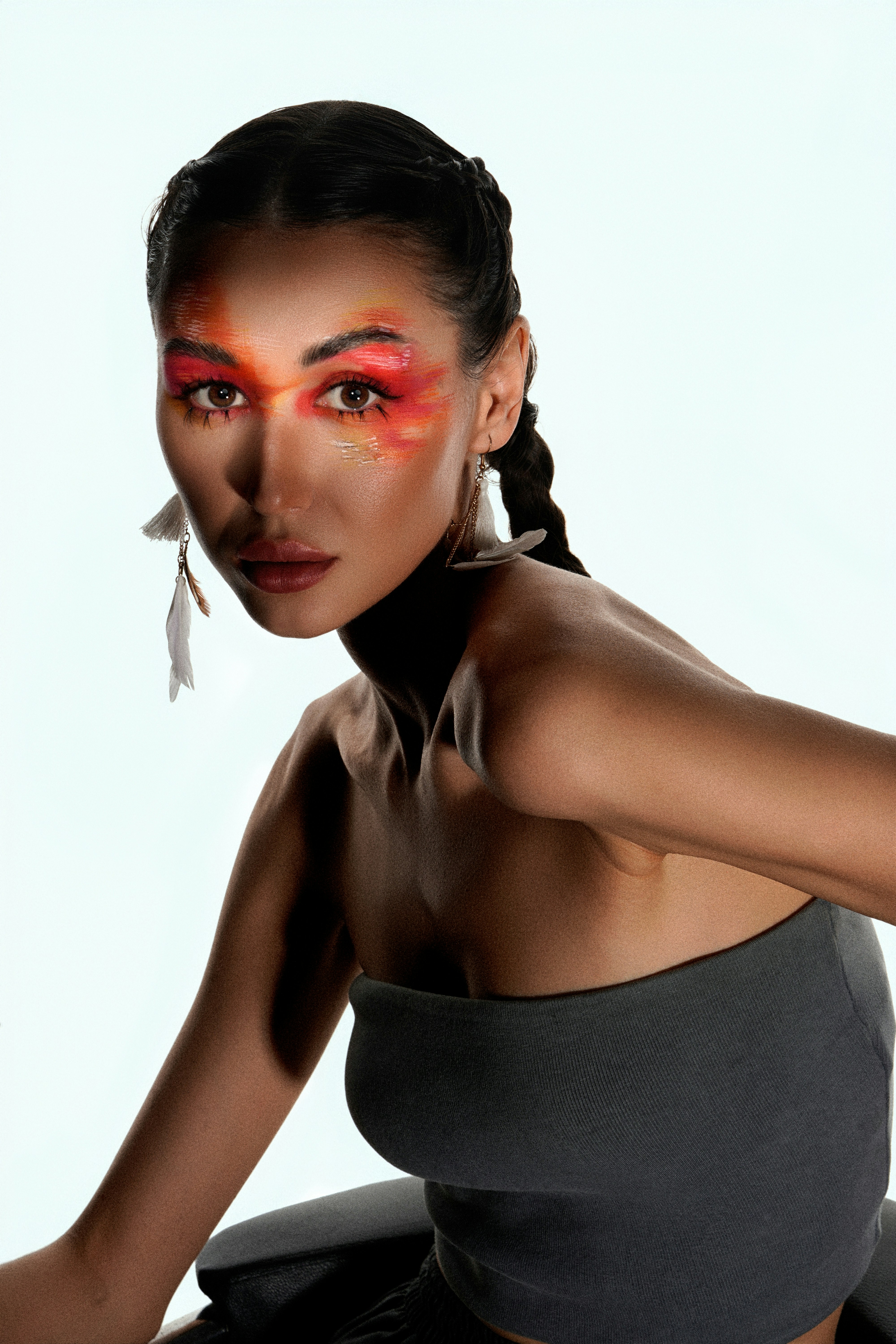 Woman with dramatic makeup and braided hair