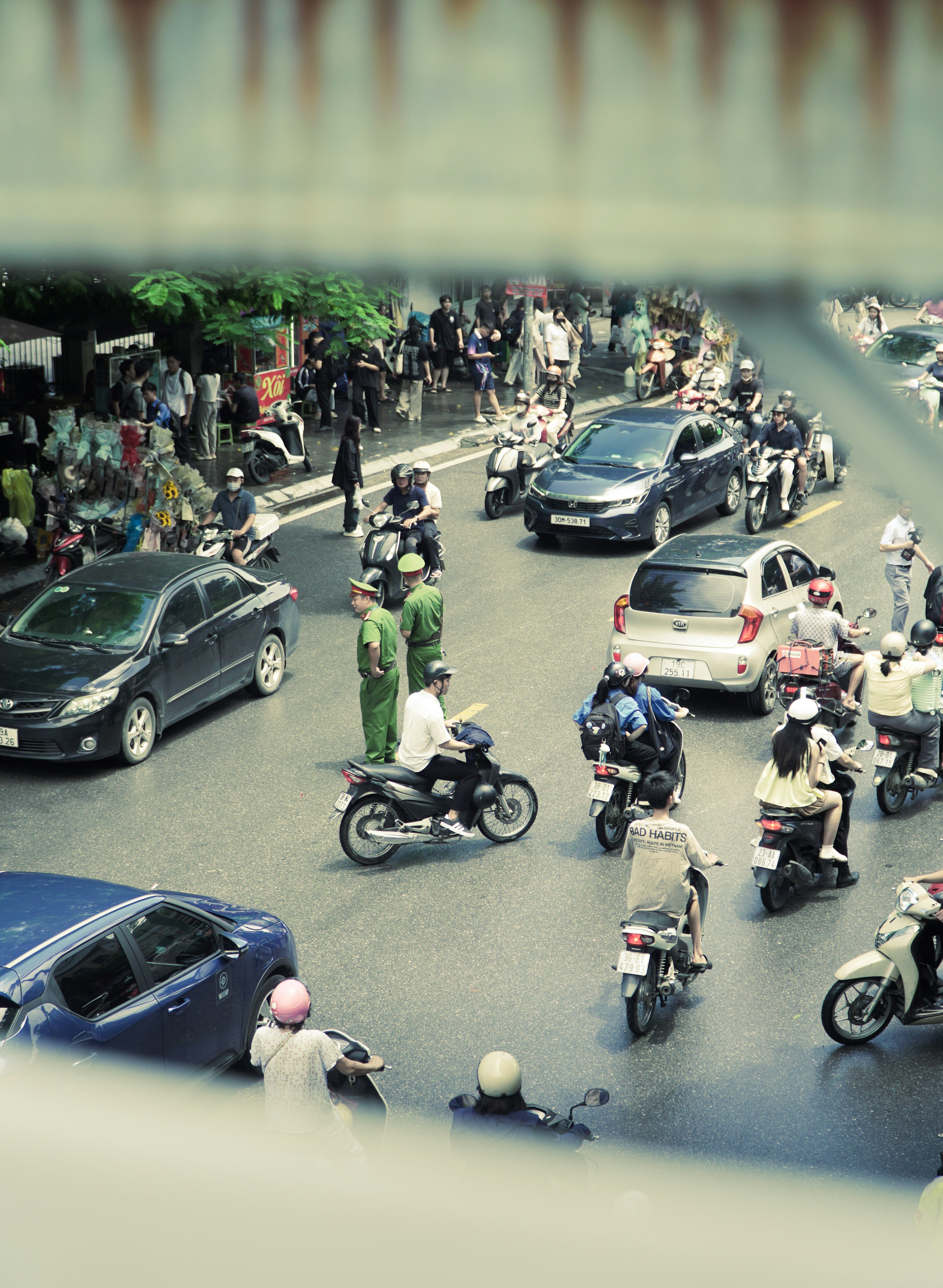 Busy city street with cars and motorcycles