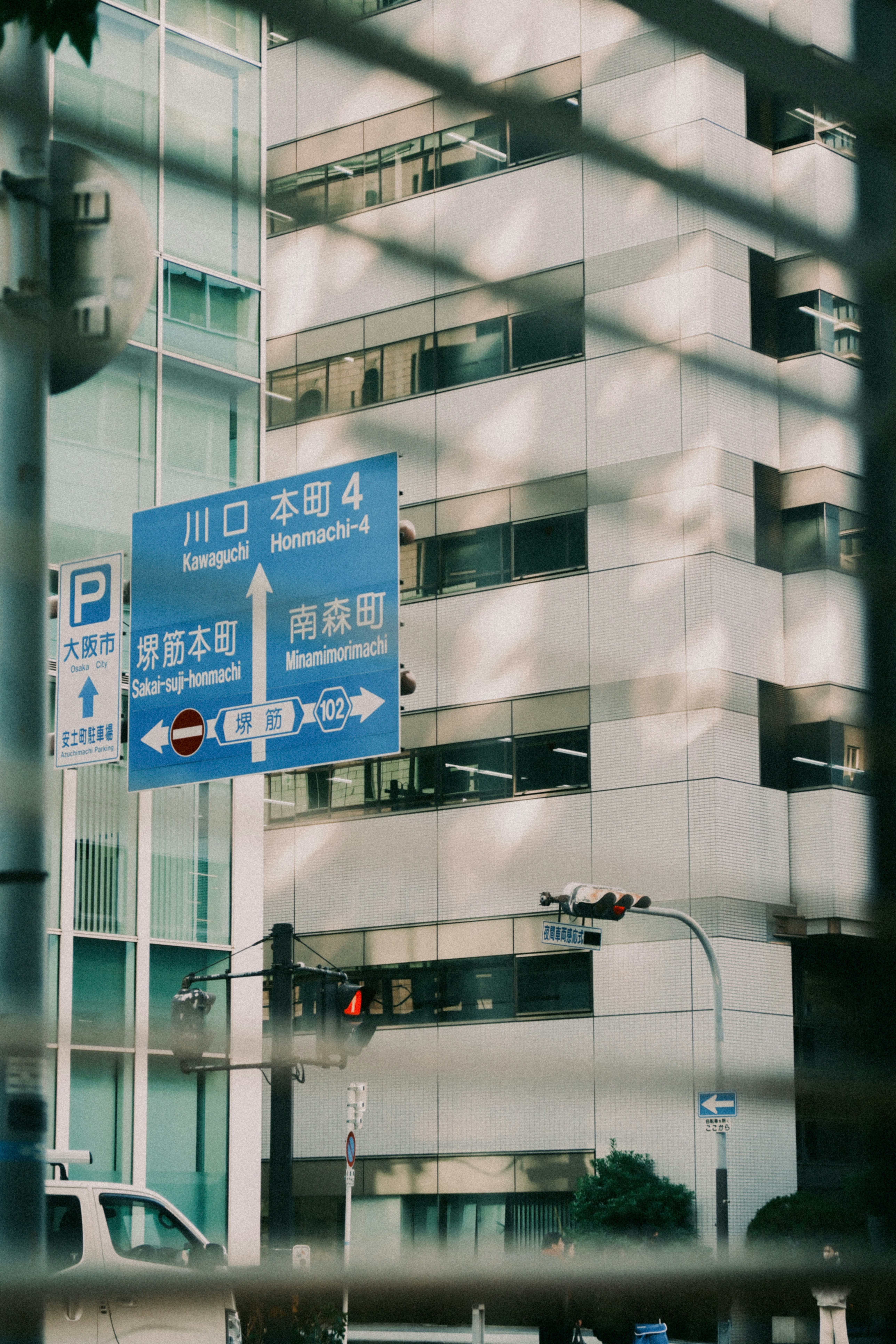 Street sign with directions in front of modern buildings photo – Free ...