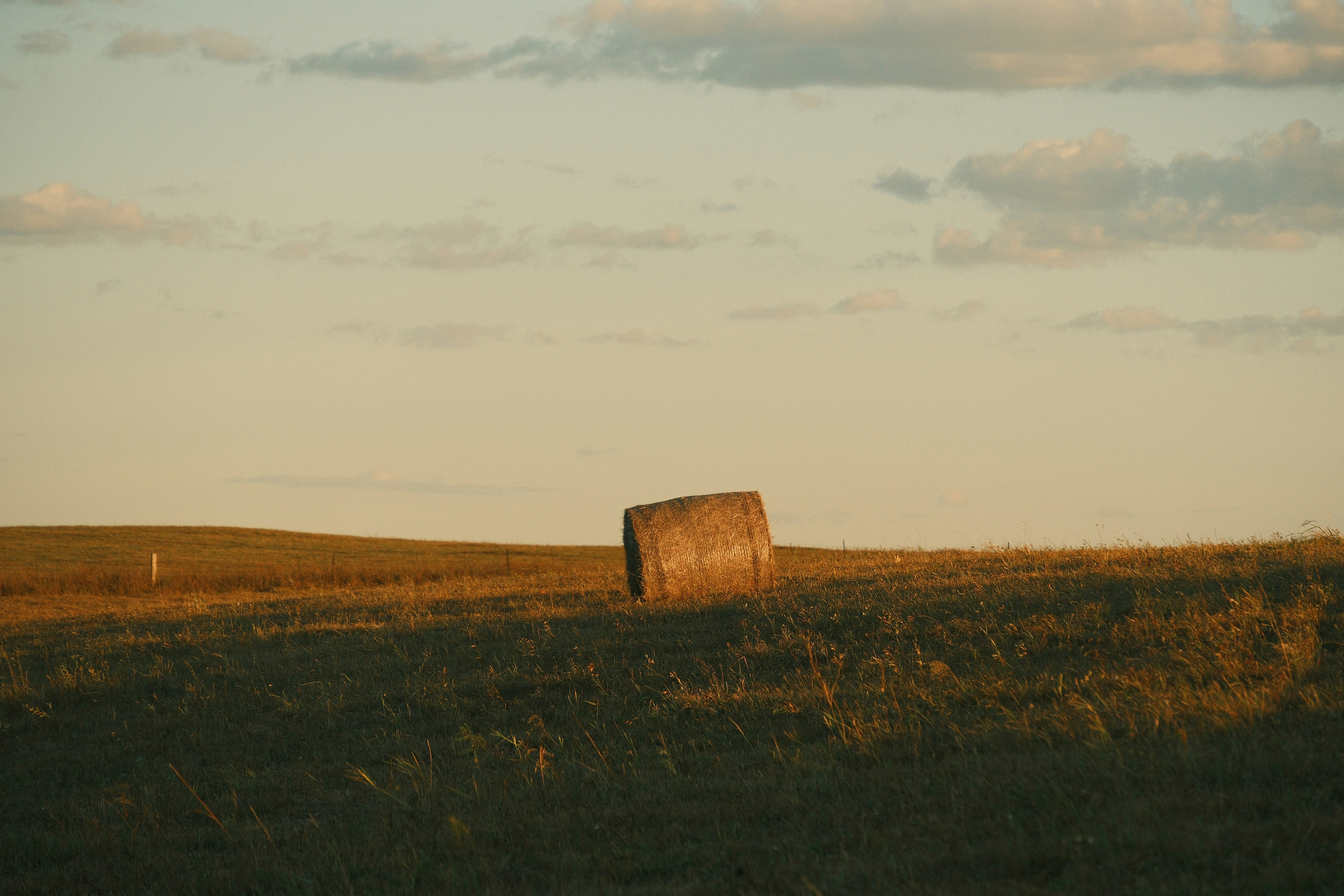 Solitary Round Bale: A Quiet Moment in the Golden Hour