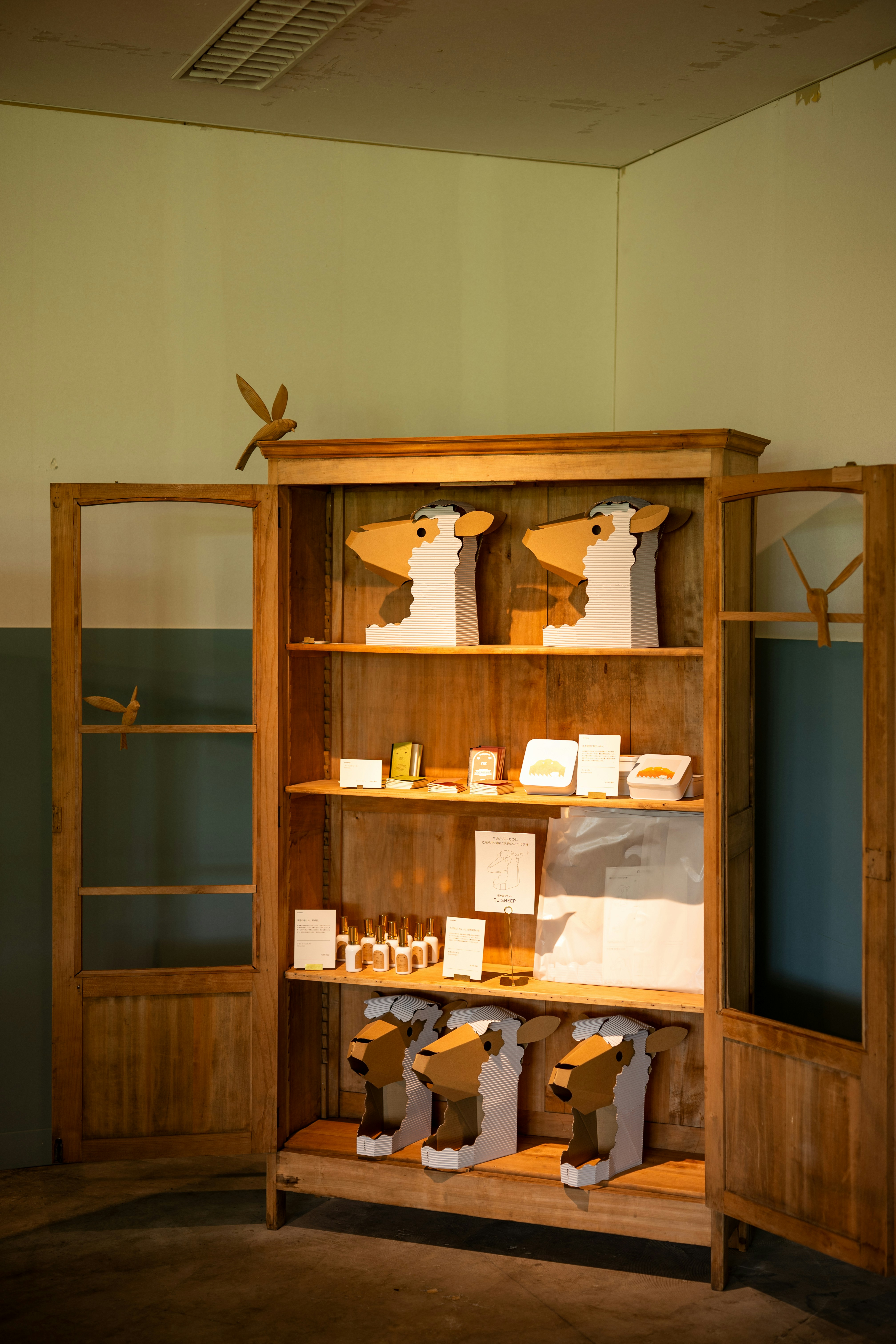 Whimsical Display of Creativity in a Rustic Cabinet
