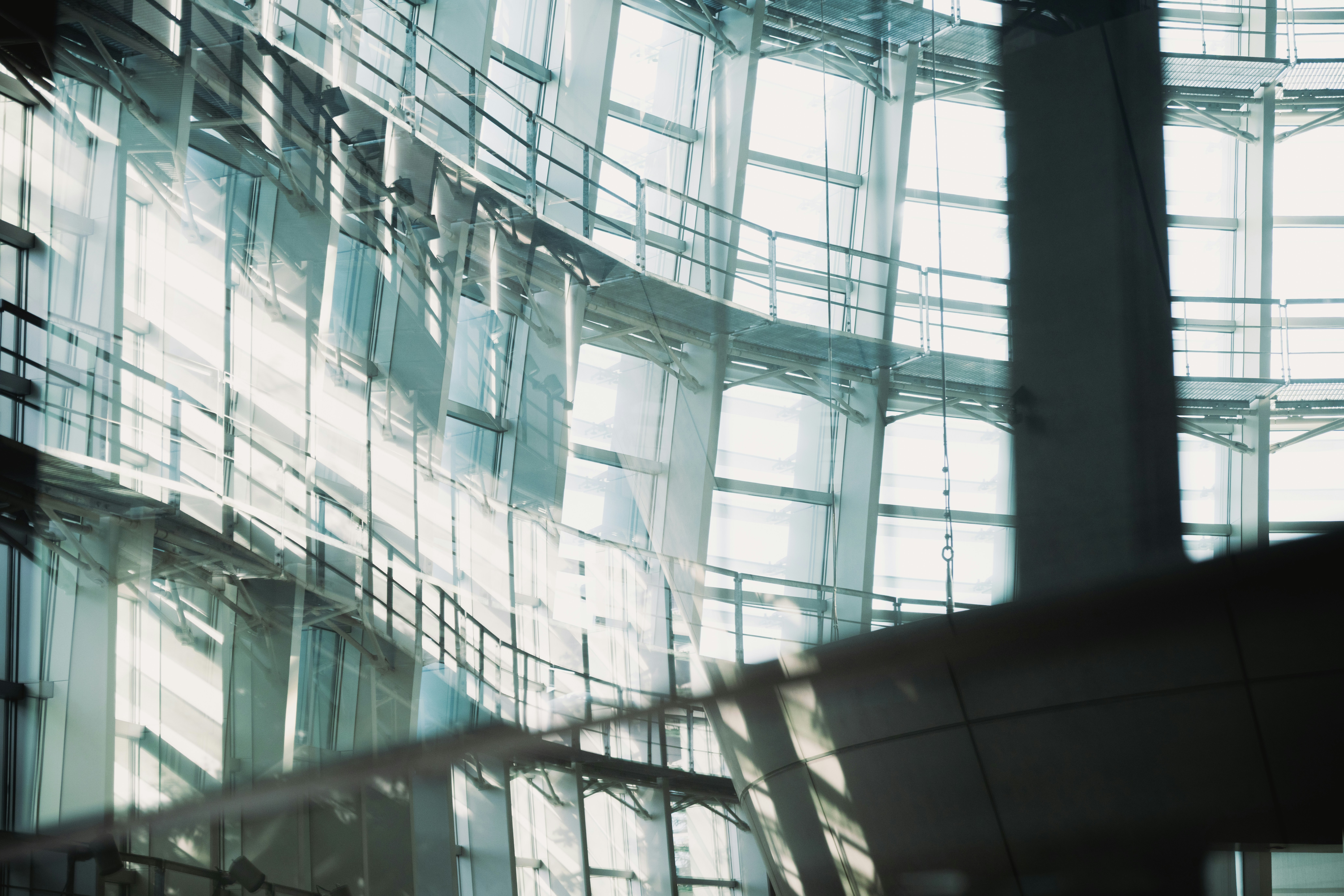 Modern glass building interior with reflections