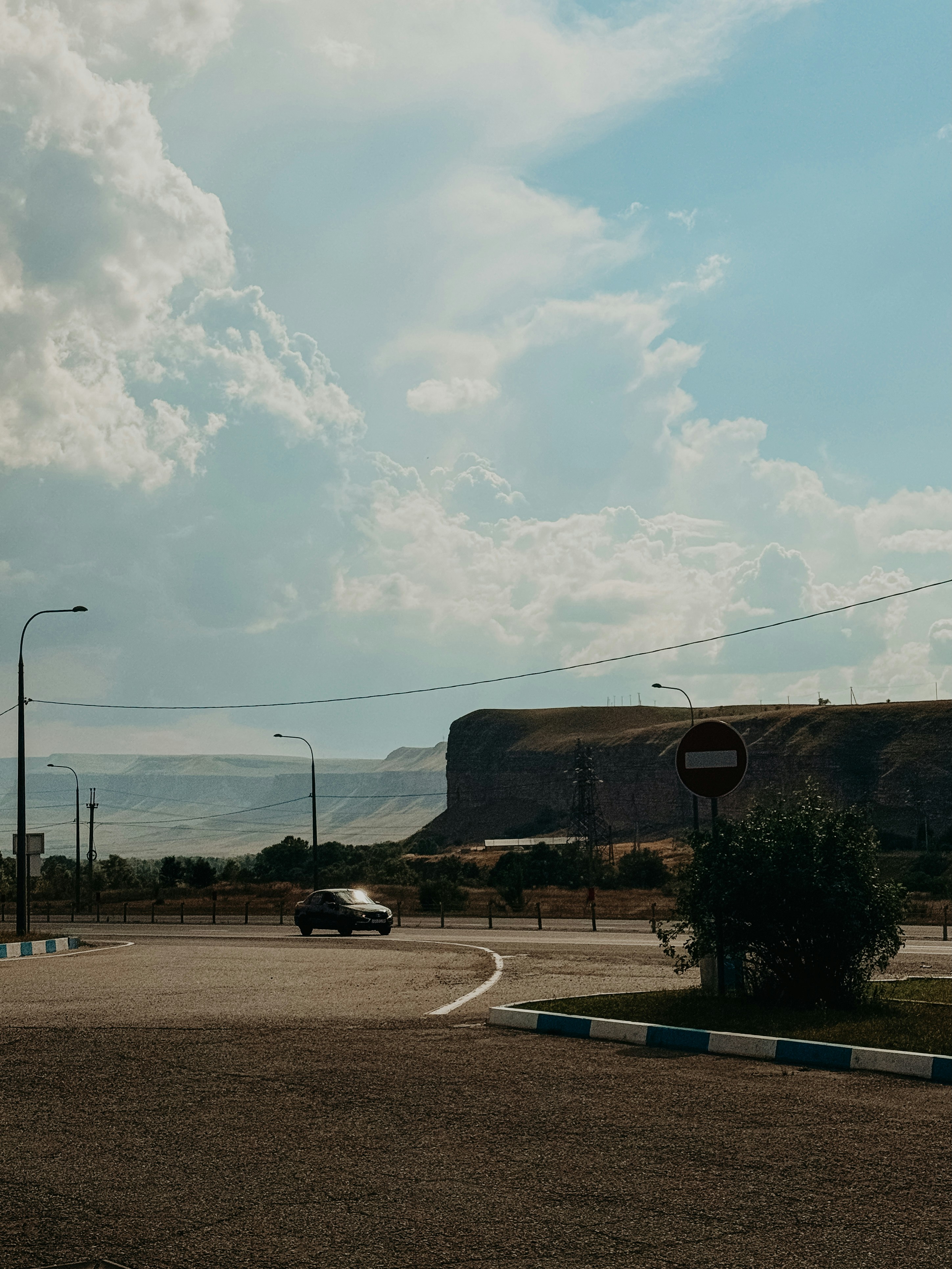 Curves of the Open Road Beneath a Vast Sky