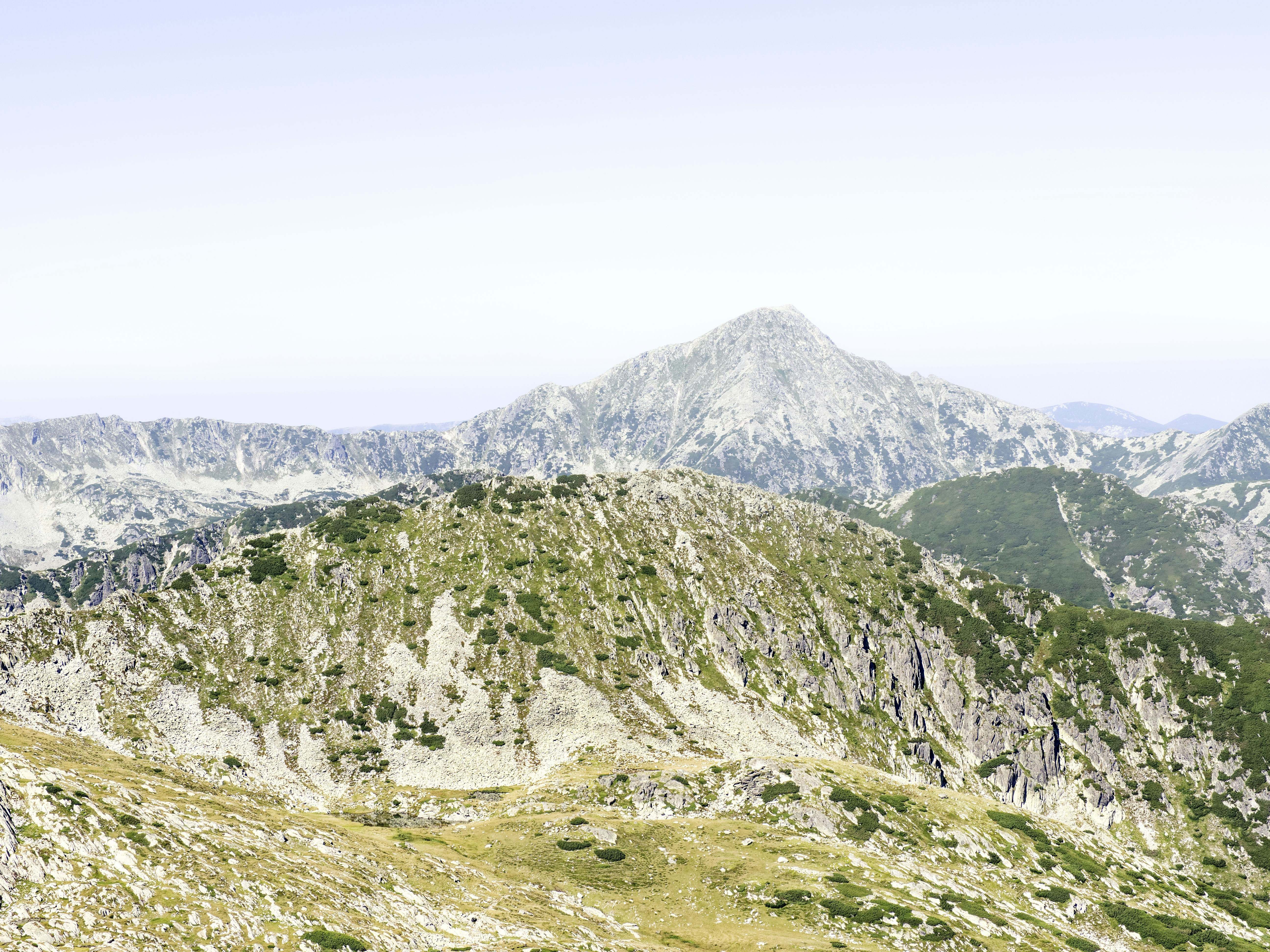 Rugged mountain peaks under a clear sky