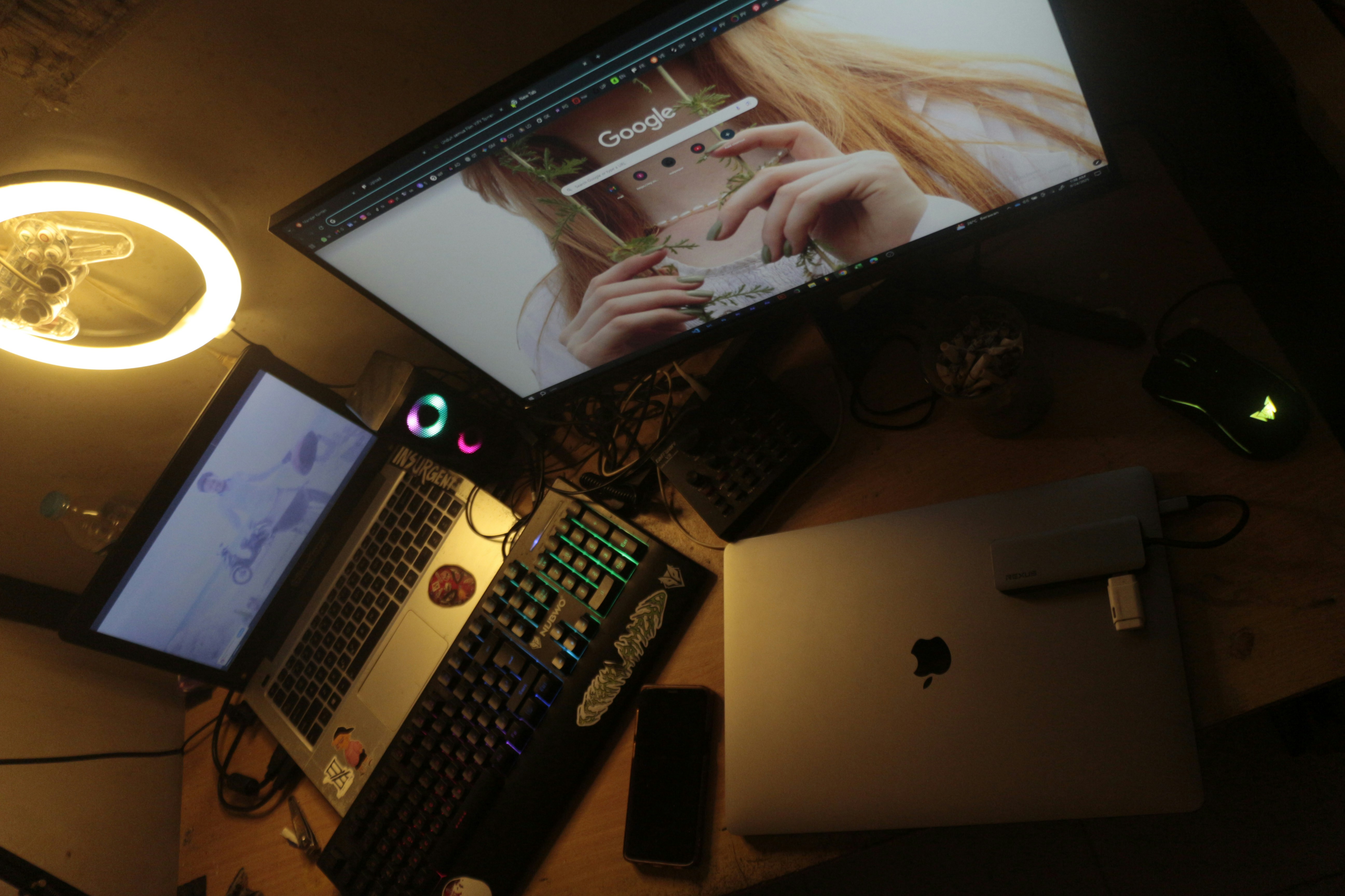 Desk setup with multiple monitors and laptop