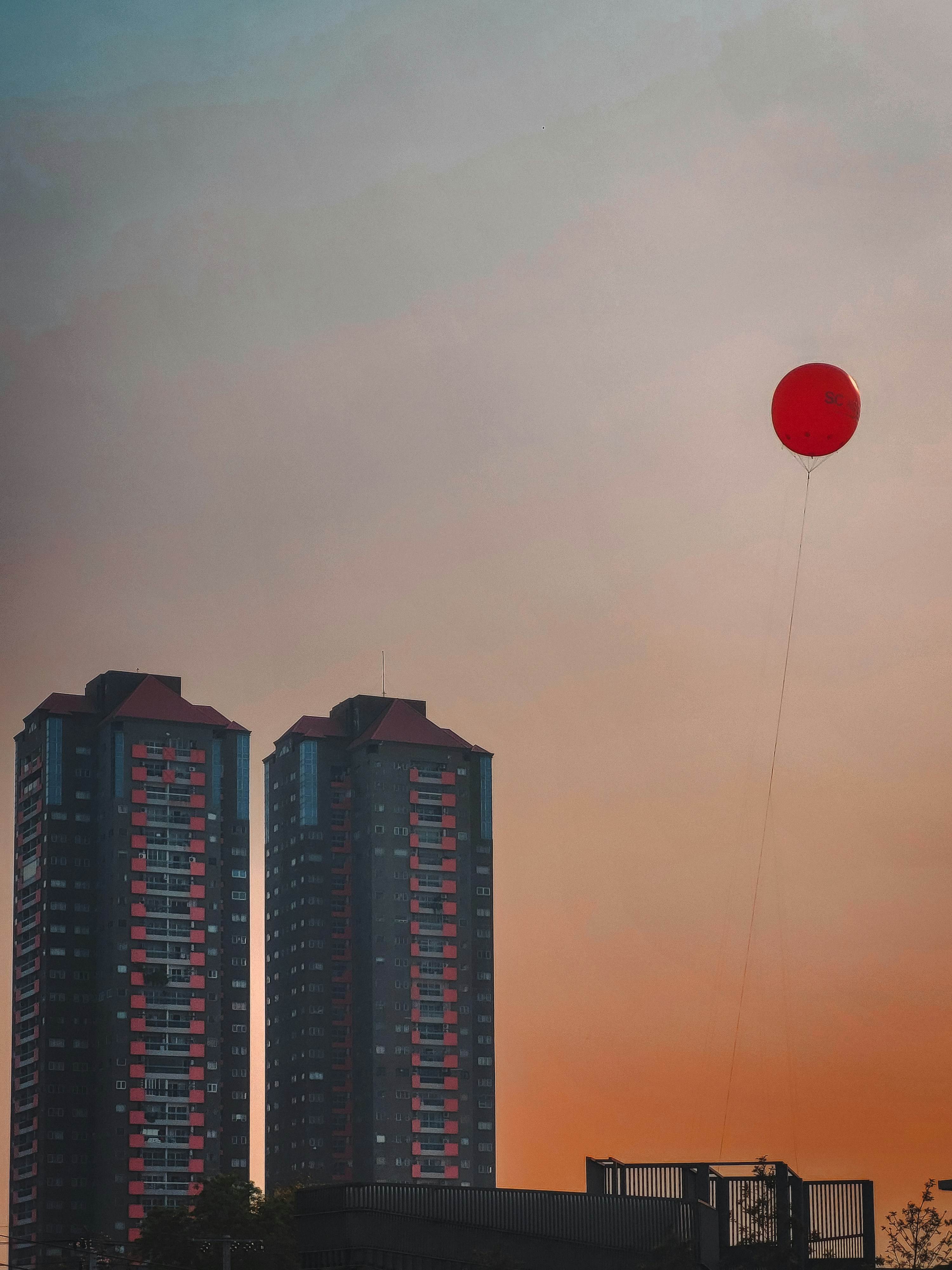 A Balloon's Ascent: Urban Dreams in the Twilight