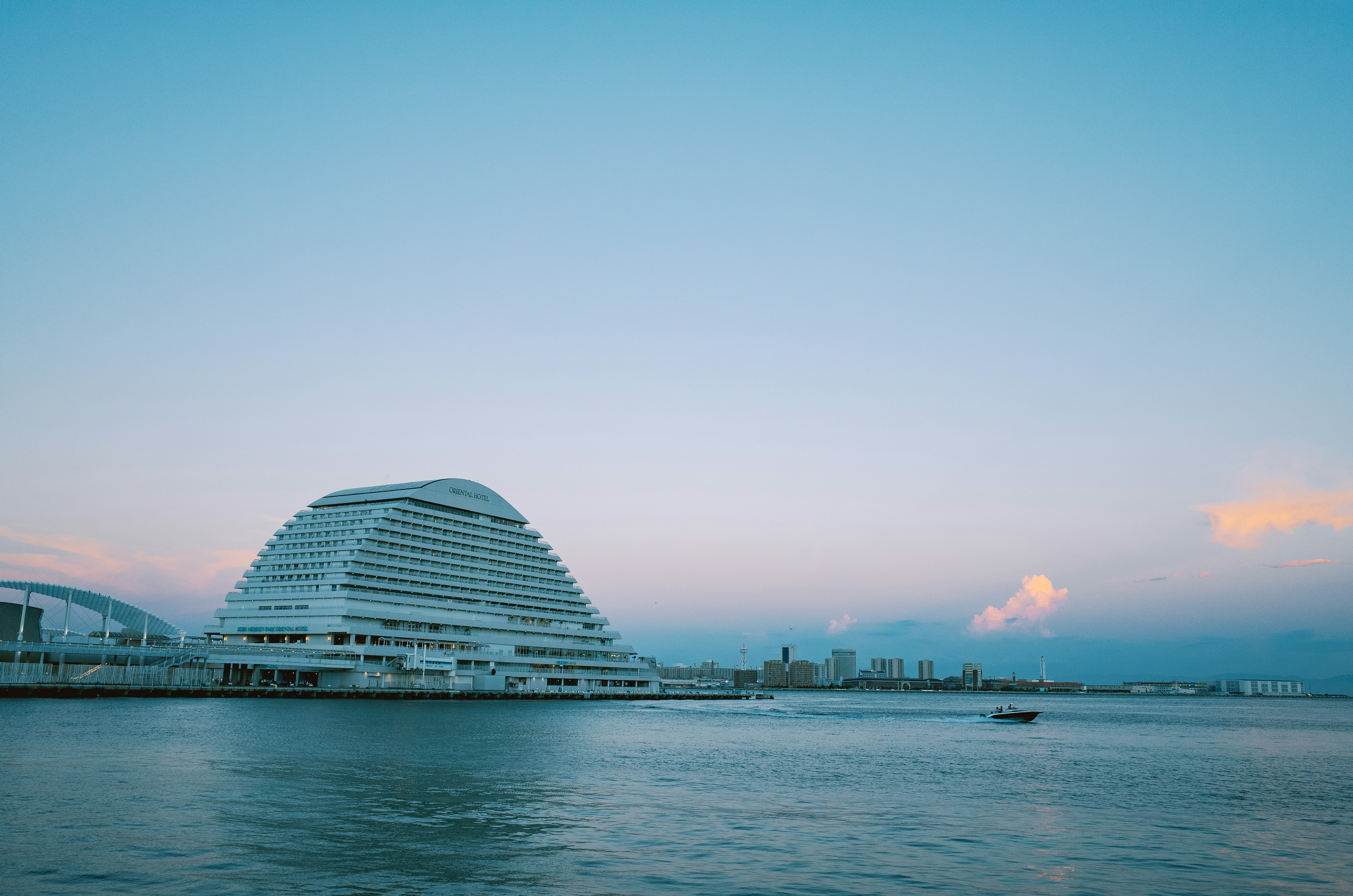 Harbor Silhouette: The Shell-shaped Pavilion by the Quiet Sea