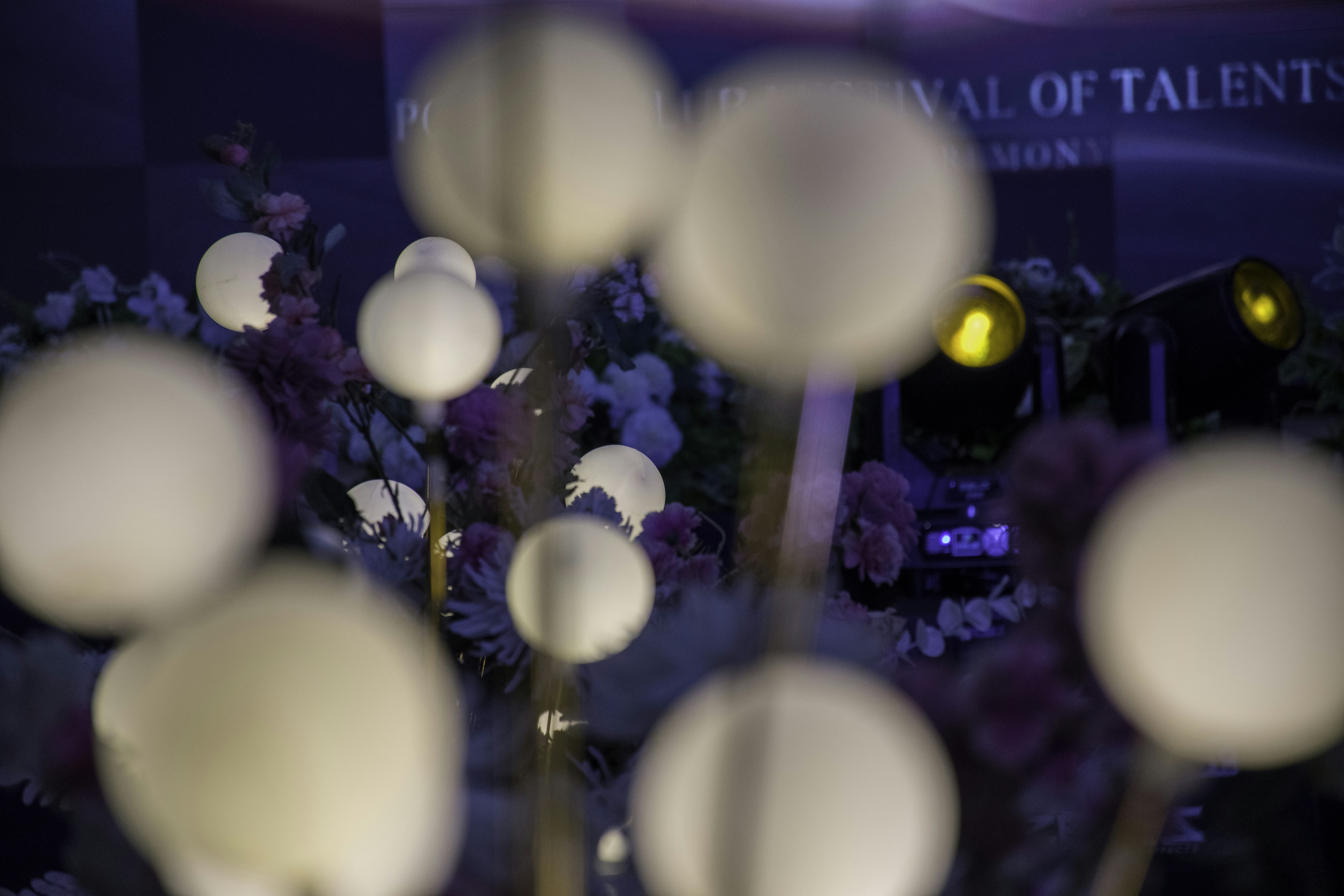 Orb Bloom: Light Orbs Framing a Floral Gala Stage