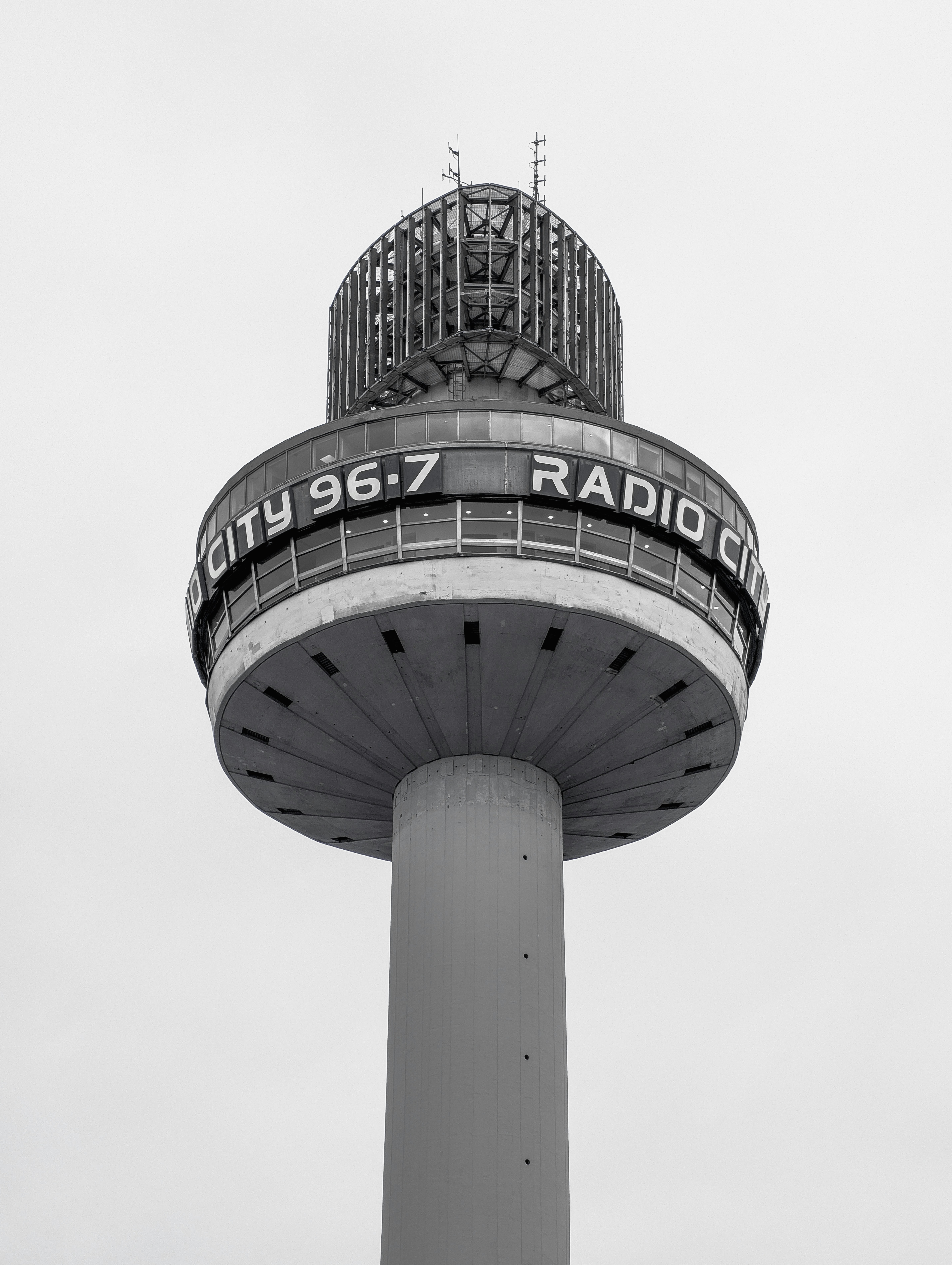 Towering above the city of Liverpool, a structure that wouldn't look out of place in your favourite vintage sci-fi movie, St John's Beacon. Also known as Radio City Tower, the Grade II listed building (built in 1969) used to be a revolving restaurant and observation deck before closing due to health and safety concerns, eventually resulting in a lack of business. It shut down in 1983, remaining unused and empty until the year 2000, when Radio City moved in. | Radio city tower against a cloudy sky