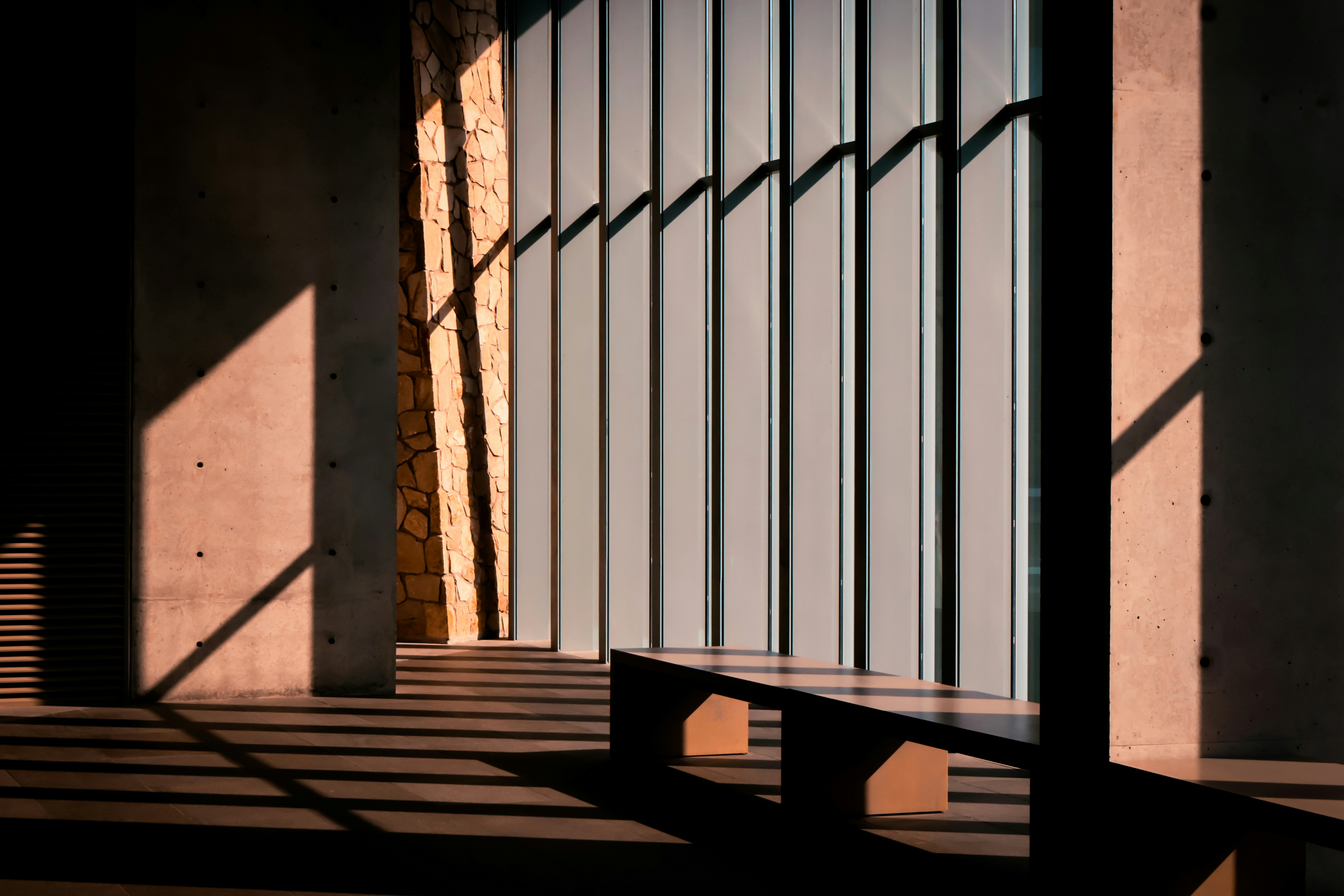 Sunlight streams through a modern architectural space.