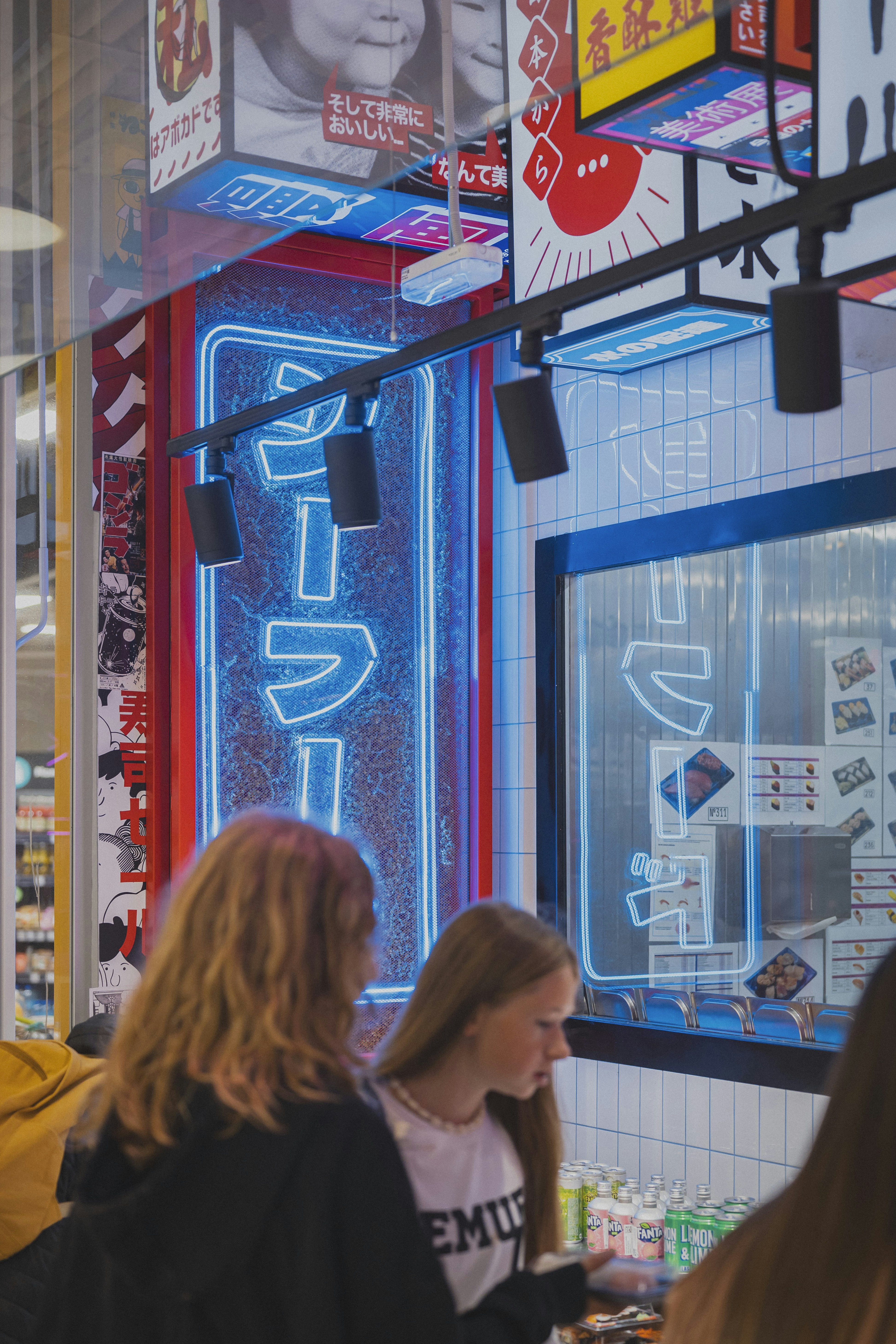 Neon signs illuminate people in a japanese restaurant. photo – Free ...
