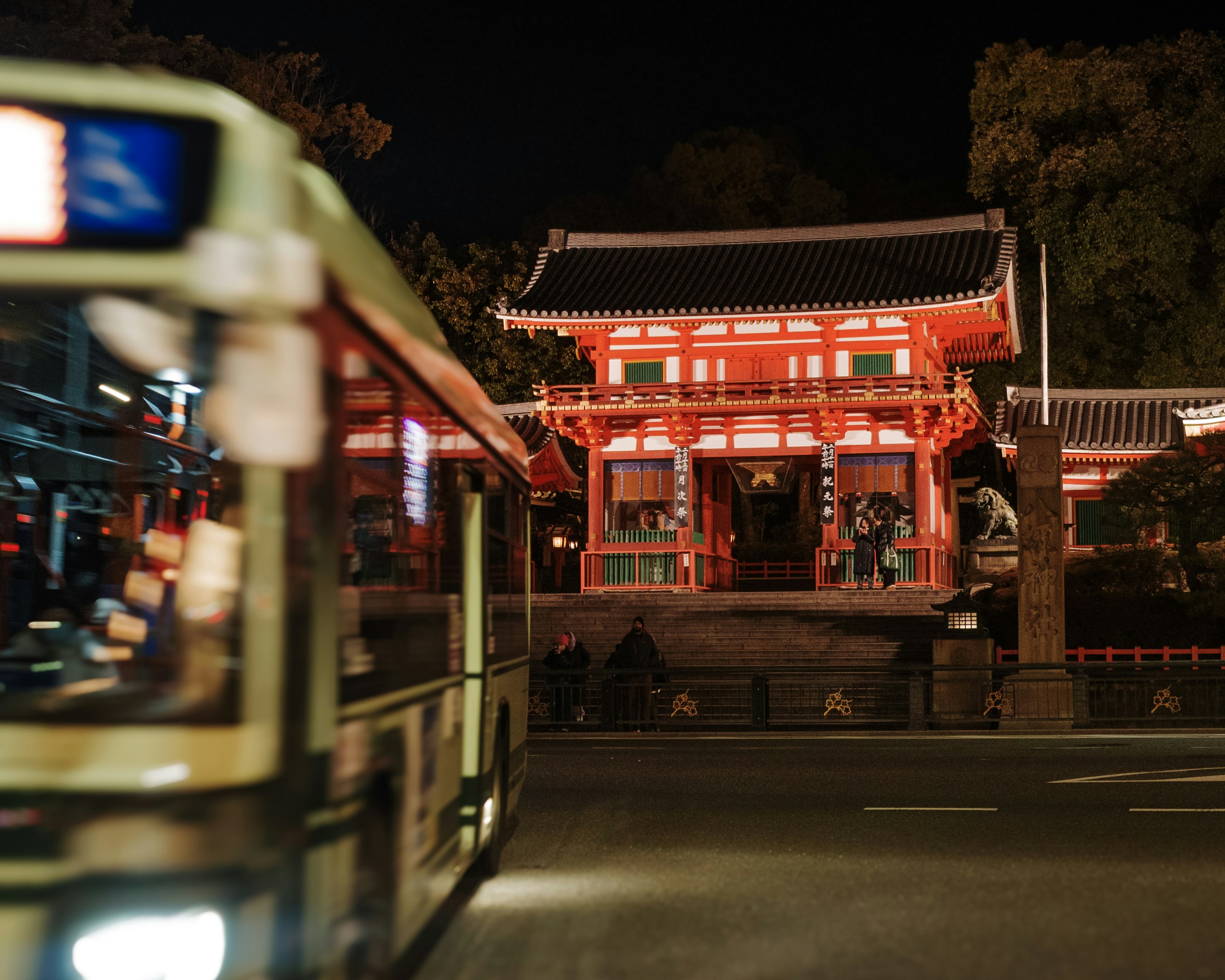 Red Gate at Night: A Busito Blur Across the Threshold
