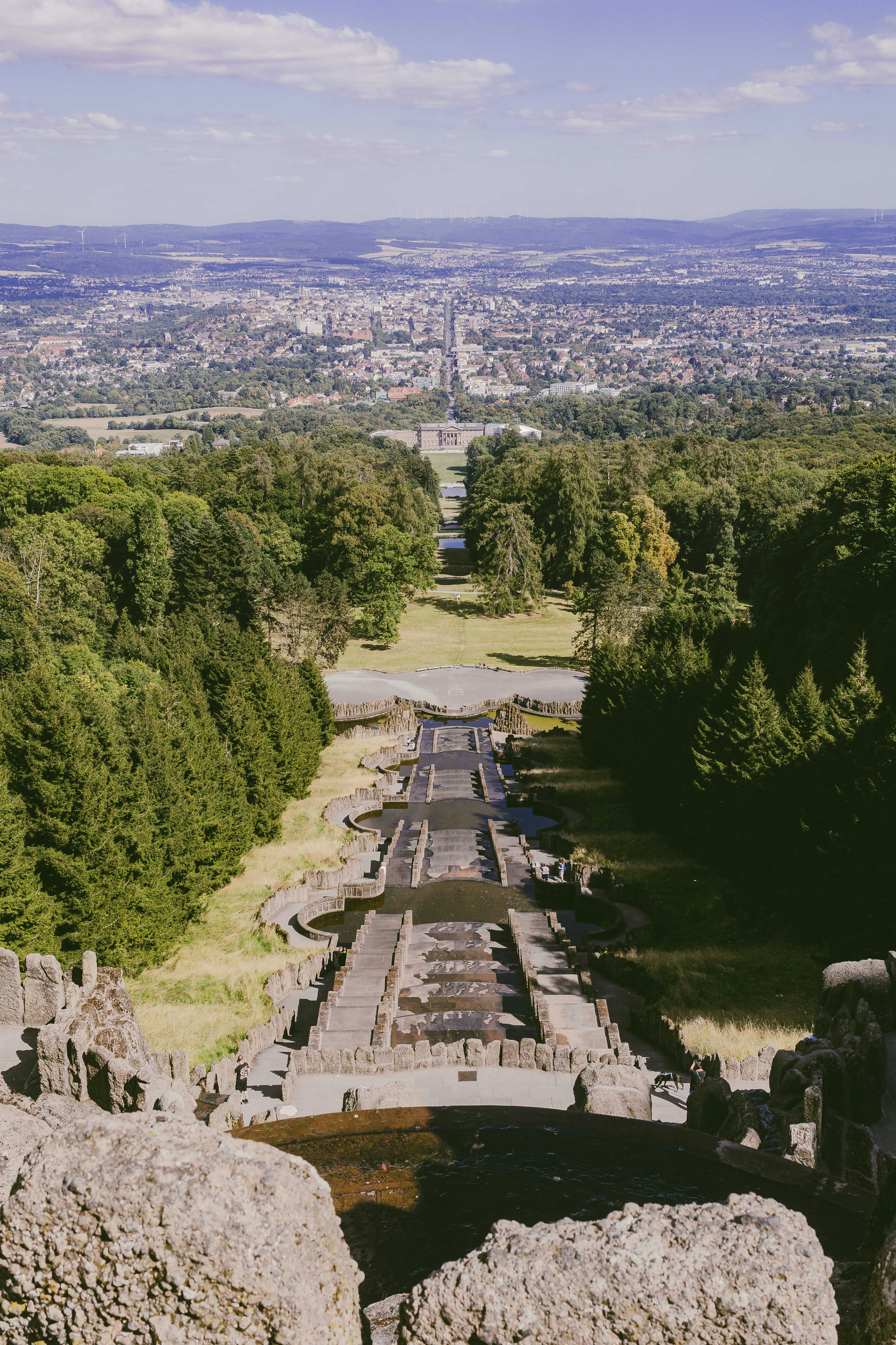 Stone Cascades Toward the City: A Verdant Descent Along a Long Staircase