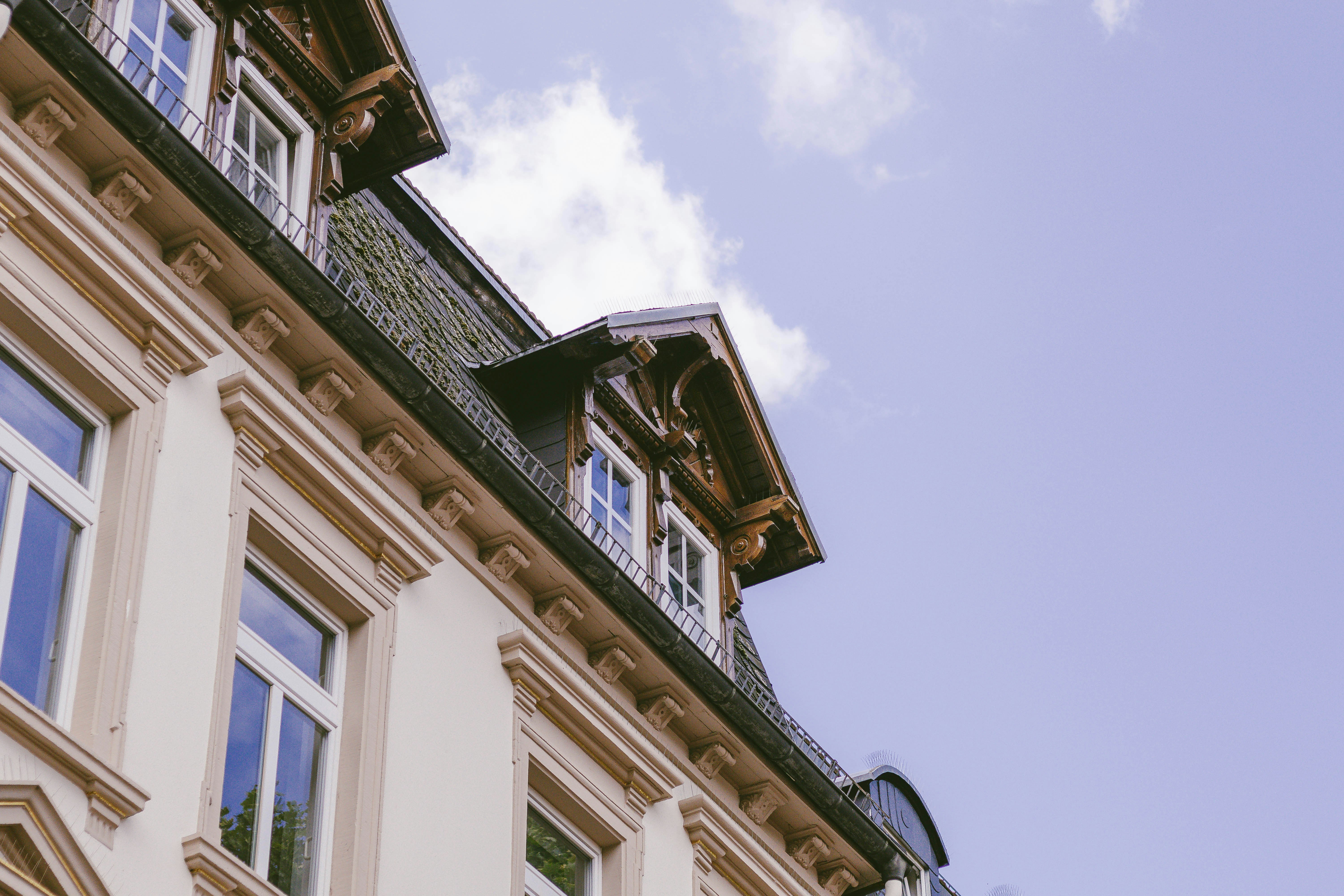 Close-up of ornate building facade against blue sky.