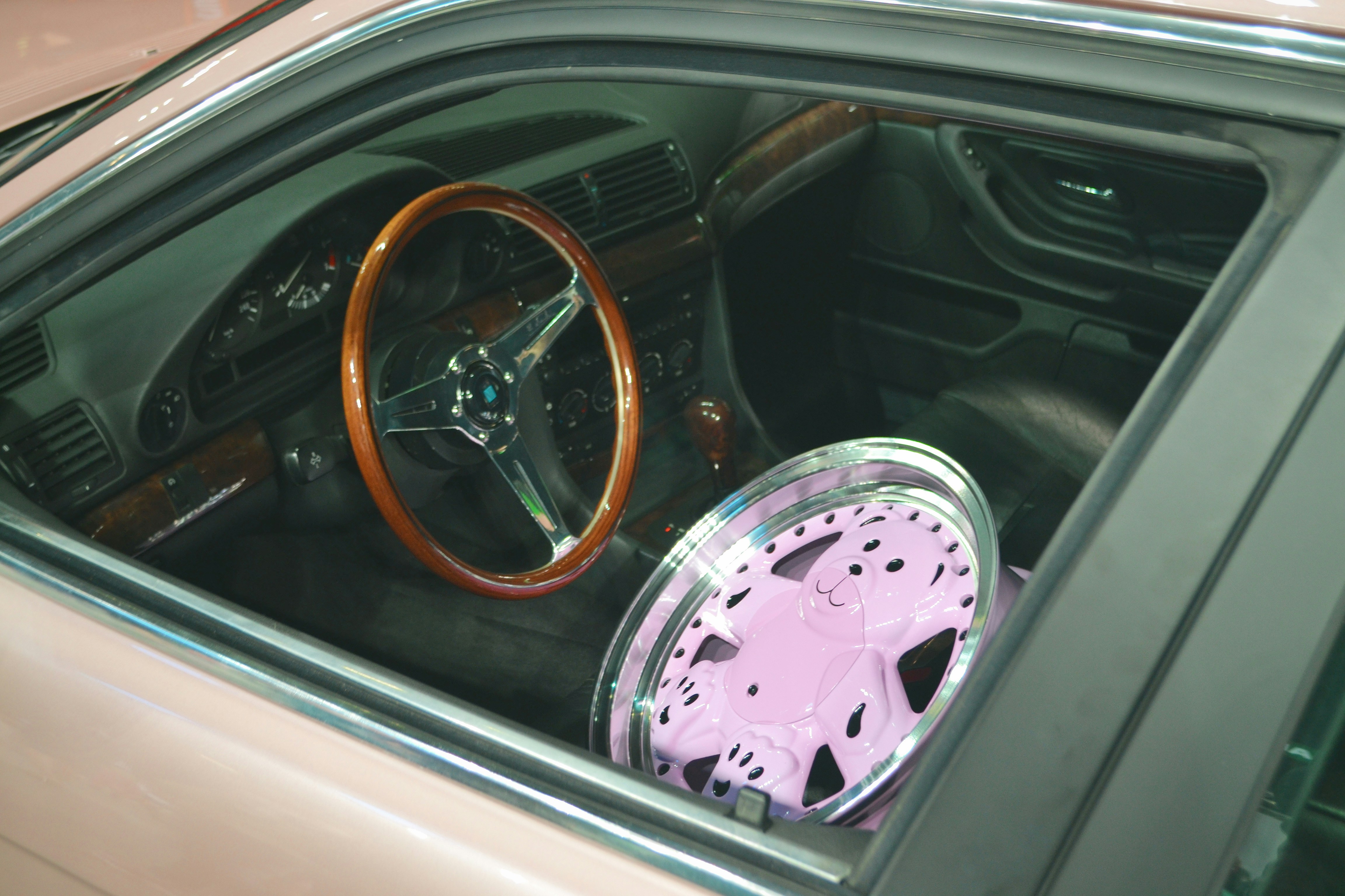 Pink wheel inside a car's interior