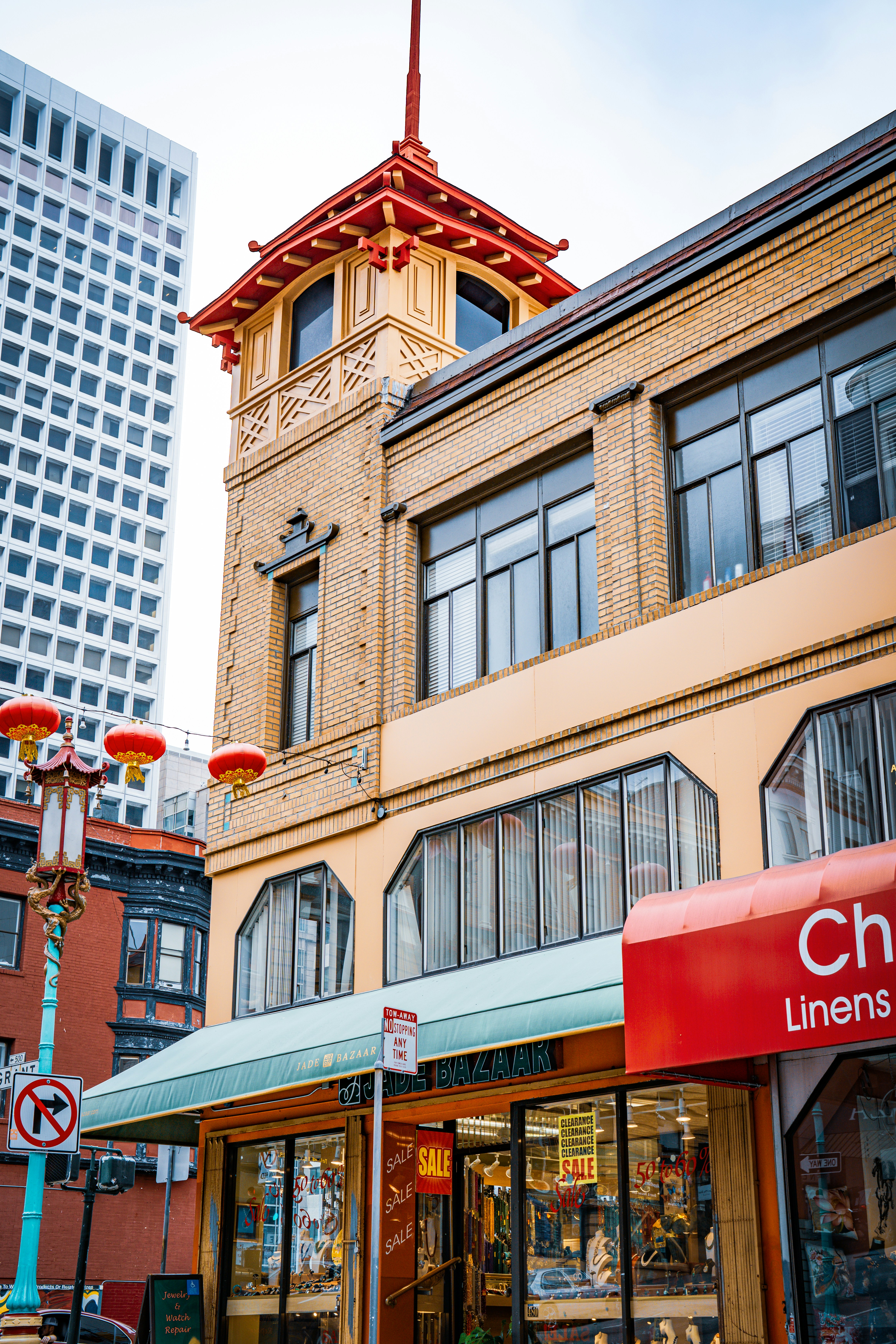 Urban Chinatown Facade: A Towering Blend of Traditional Ornament and Modern Glass