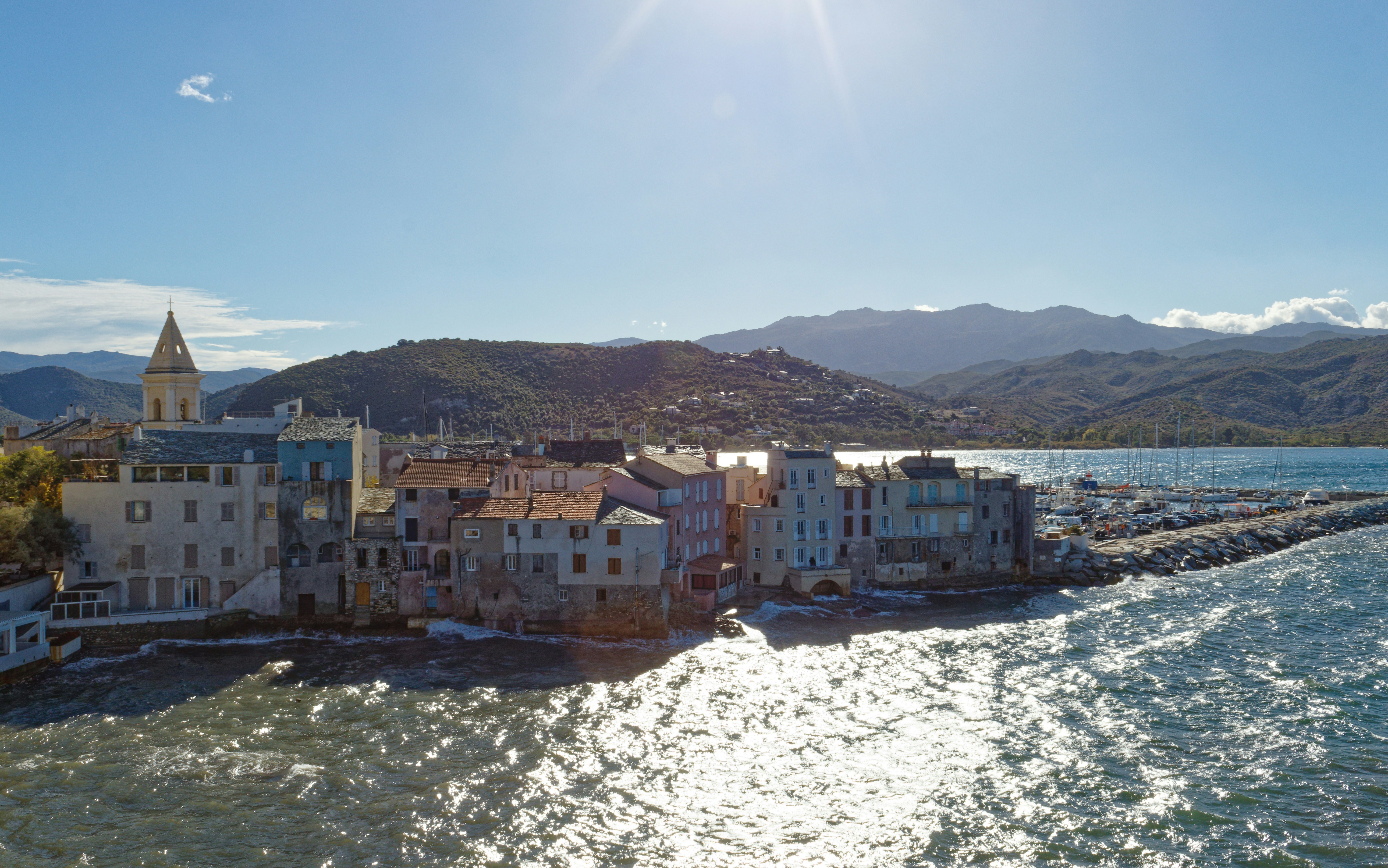 Harborfront Harmony: A Coastal Village Embraced by Nature
