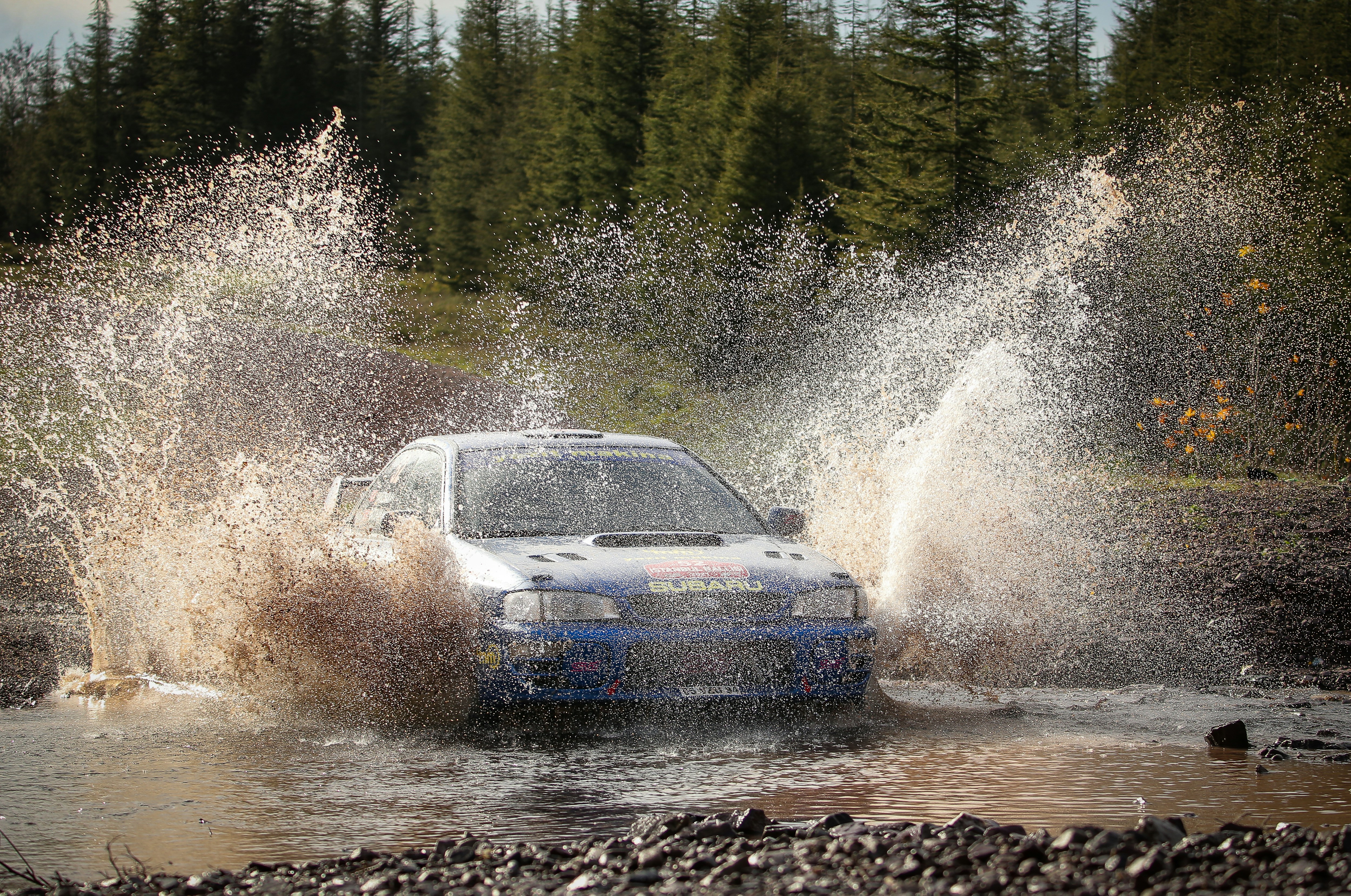 Rally car splashing through muddy water photo – Free Car Image on Unsplash