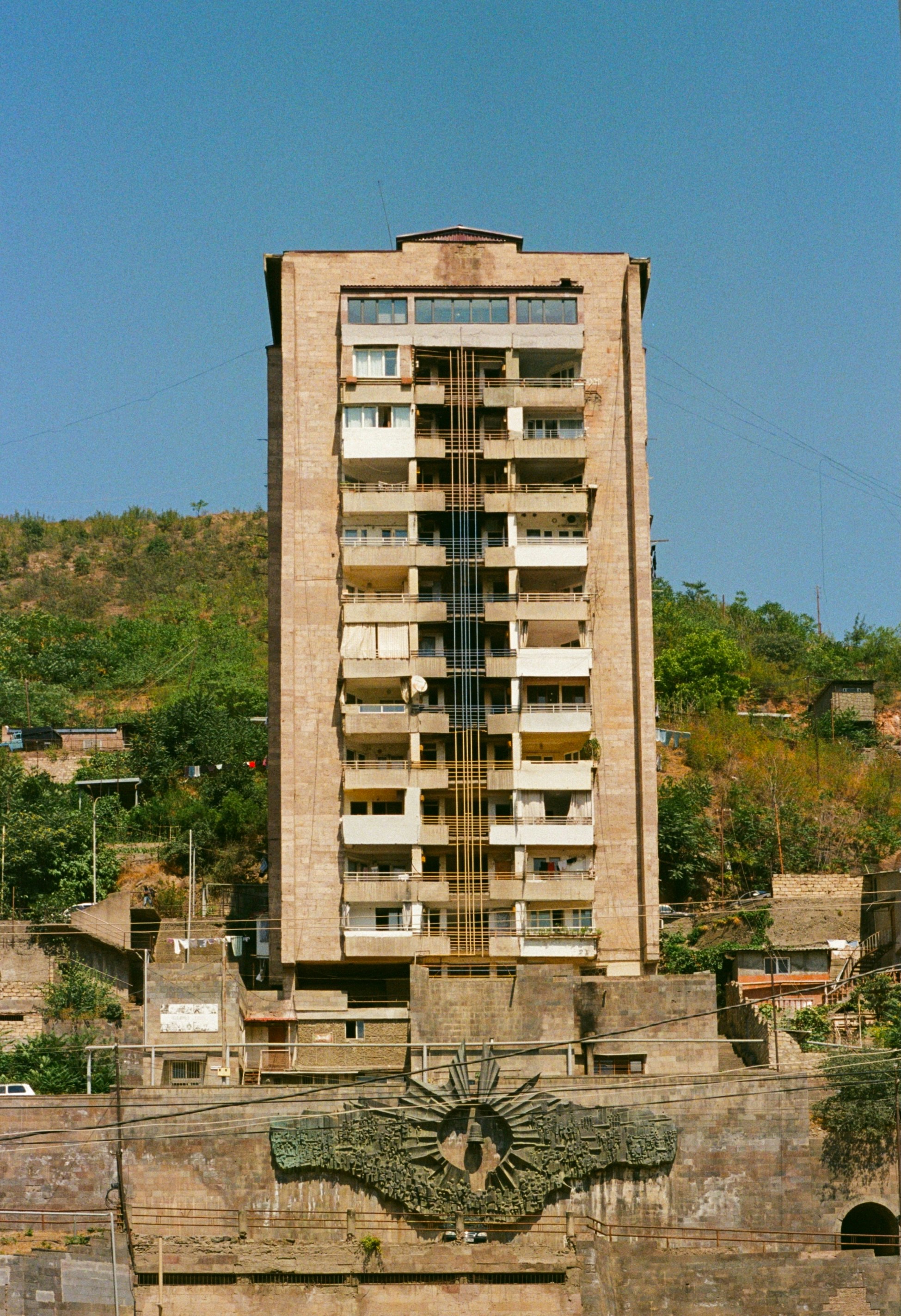 Urban Resilience: A Tower Amidst Nature's Embrace