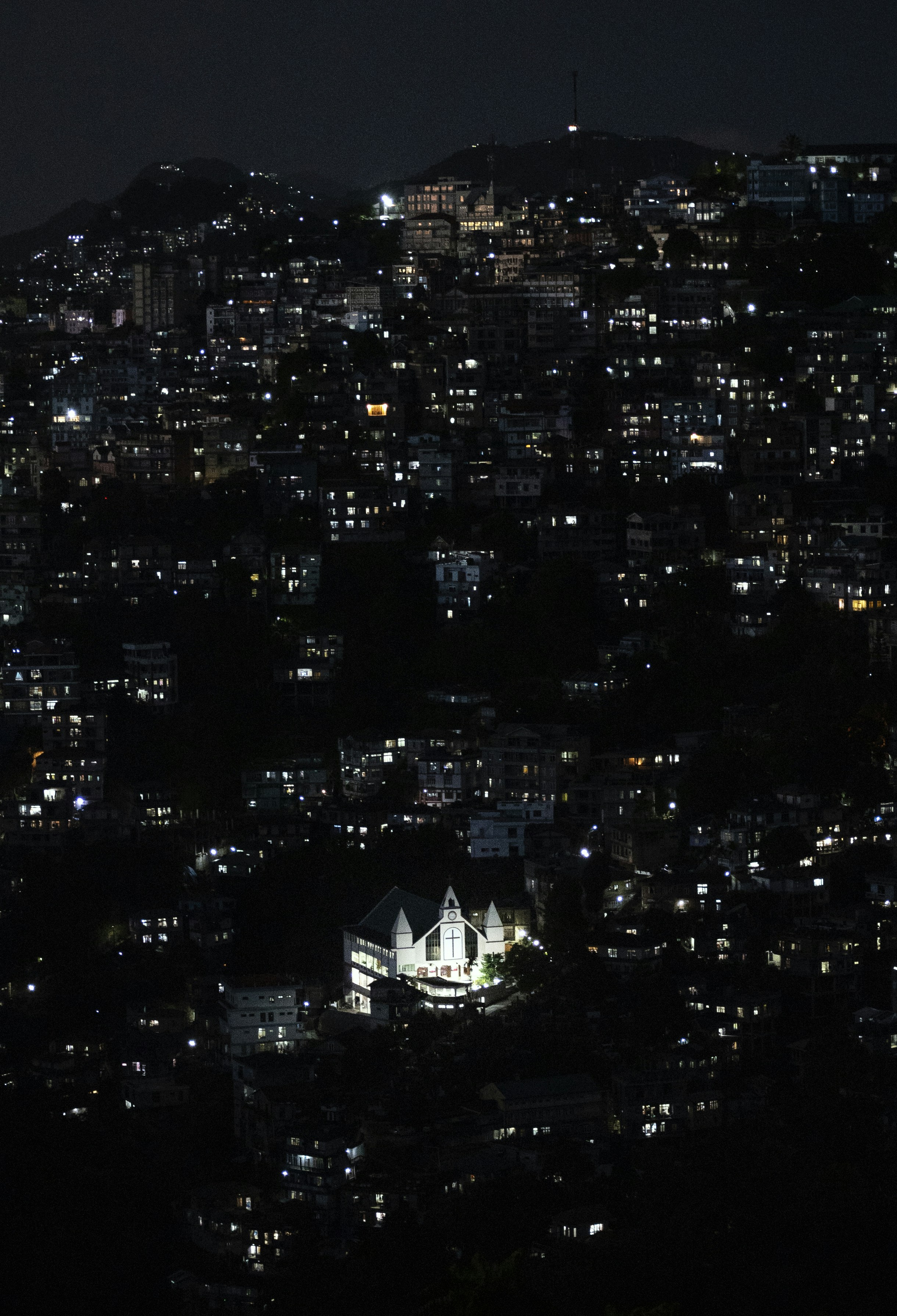 The Cross in the middle | Cityscape with illuminated buildings at night