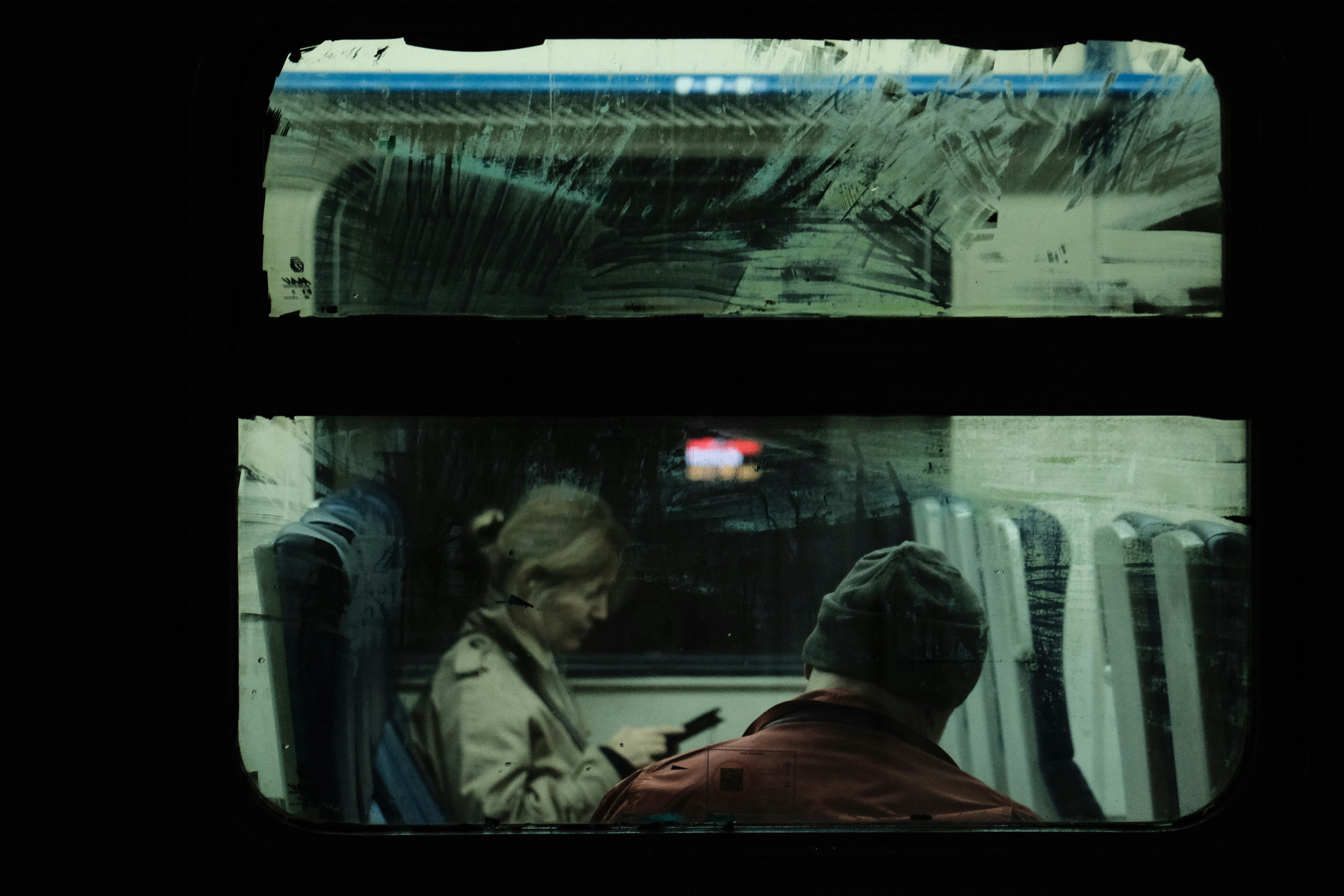 Train deviation | Passengers inside a train looking out window