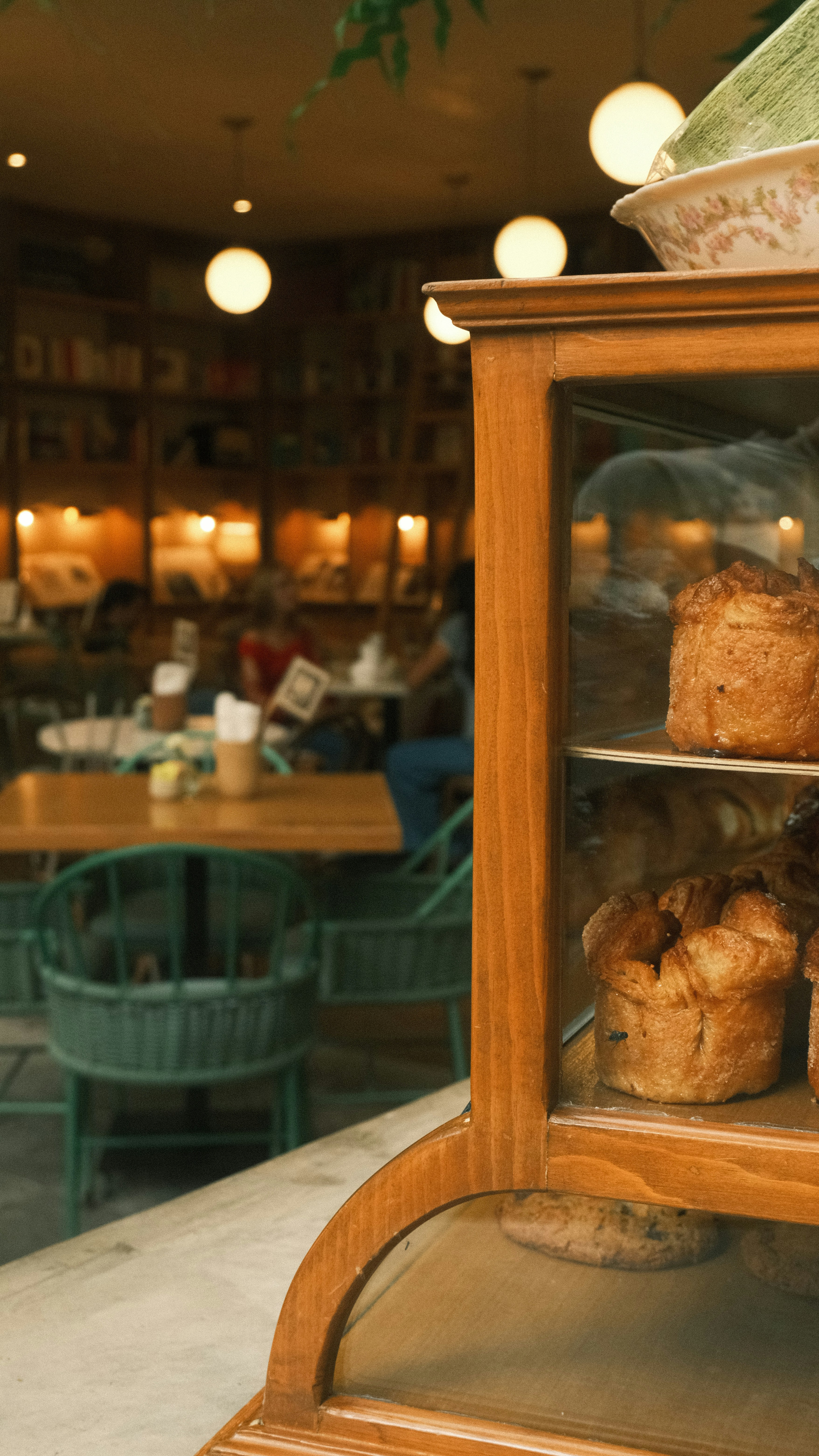 Amber Glass, Warm Lights: Pastry Window of a Quiet Café