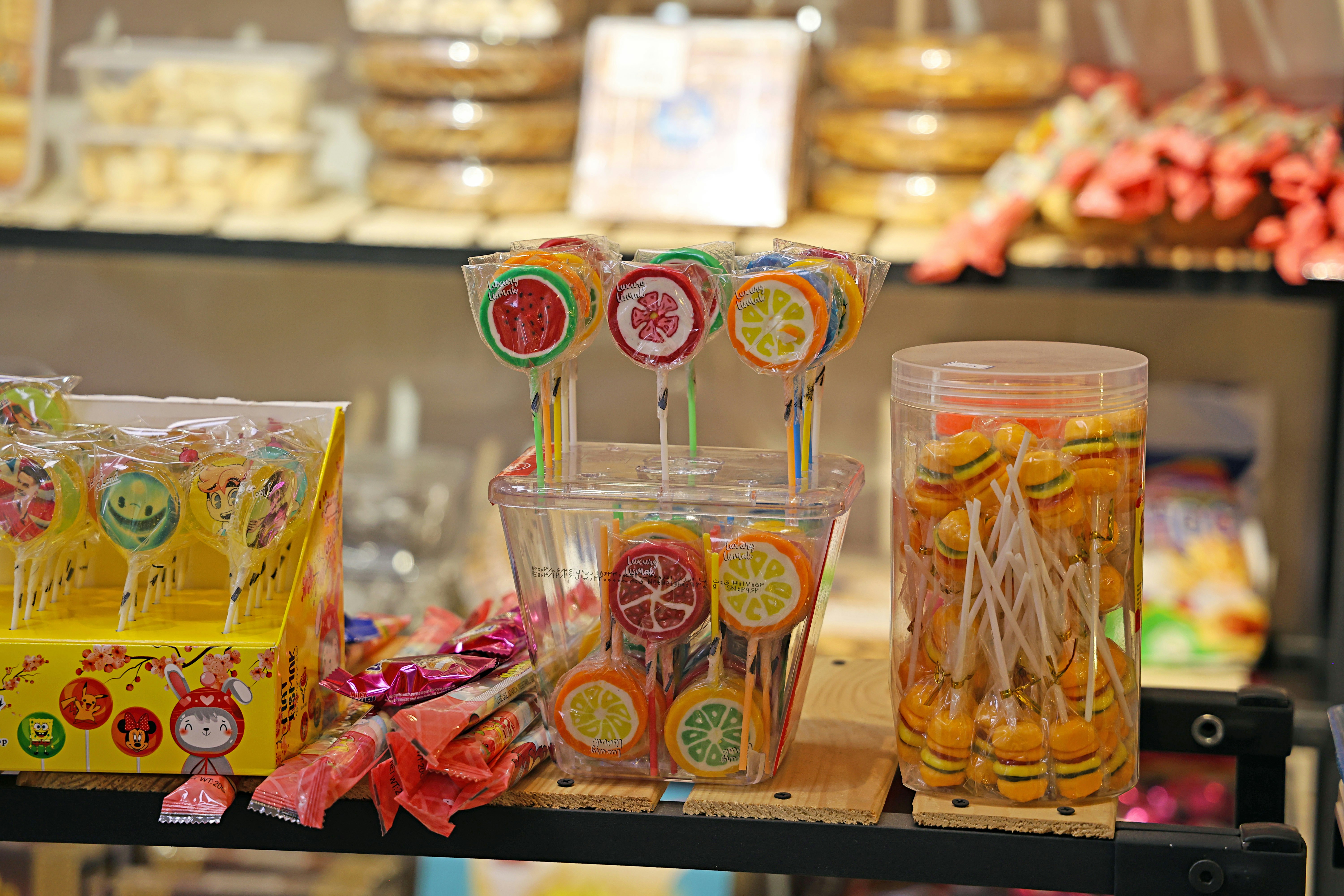 Assortment of colorful fruit-shaped lollipops and candy