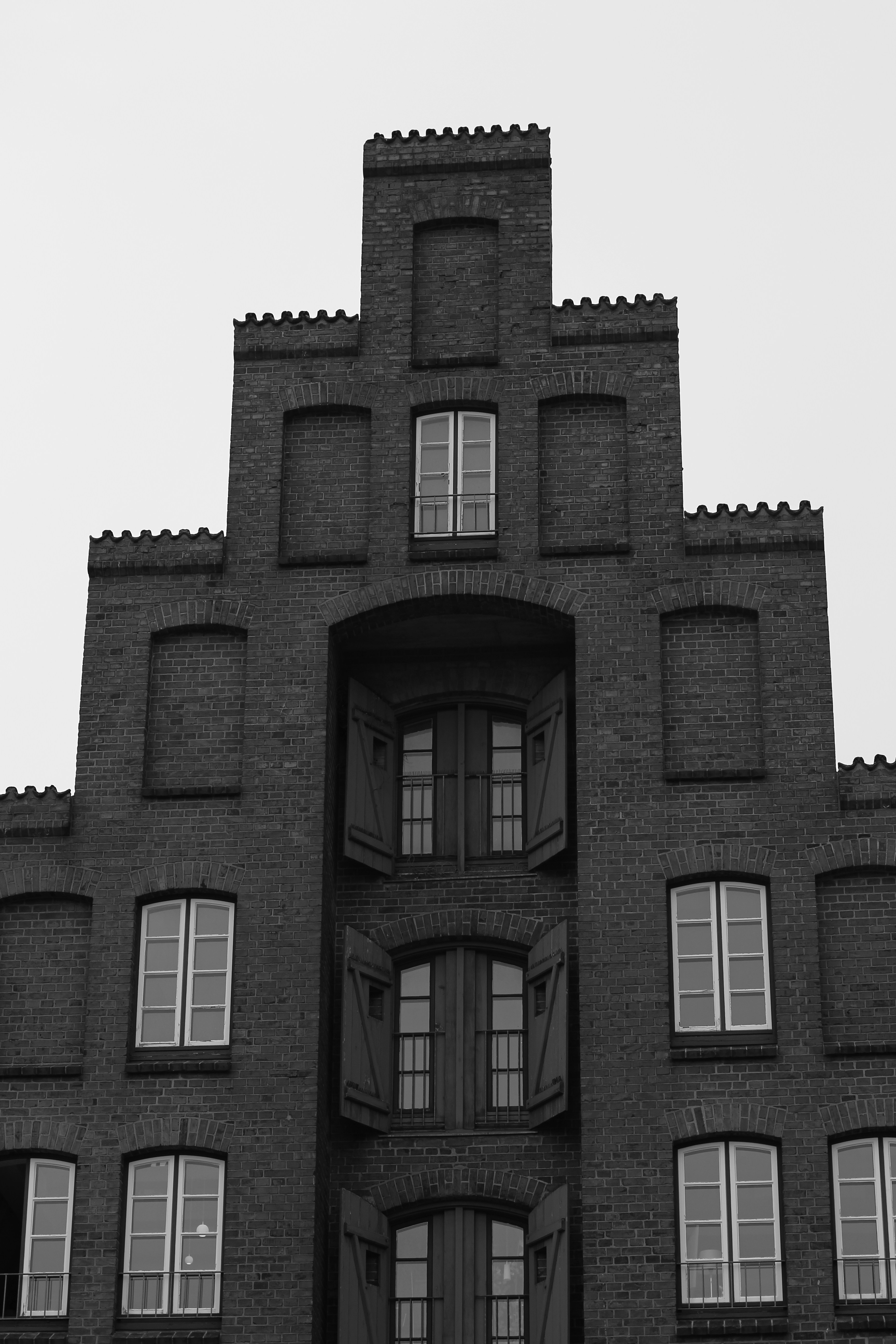 Historic brick building with stepped gable and windows