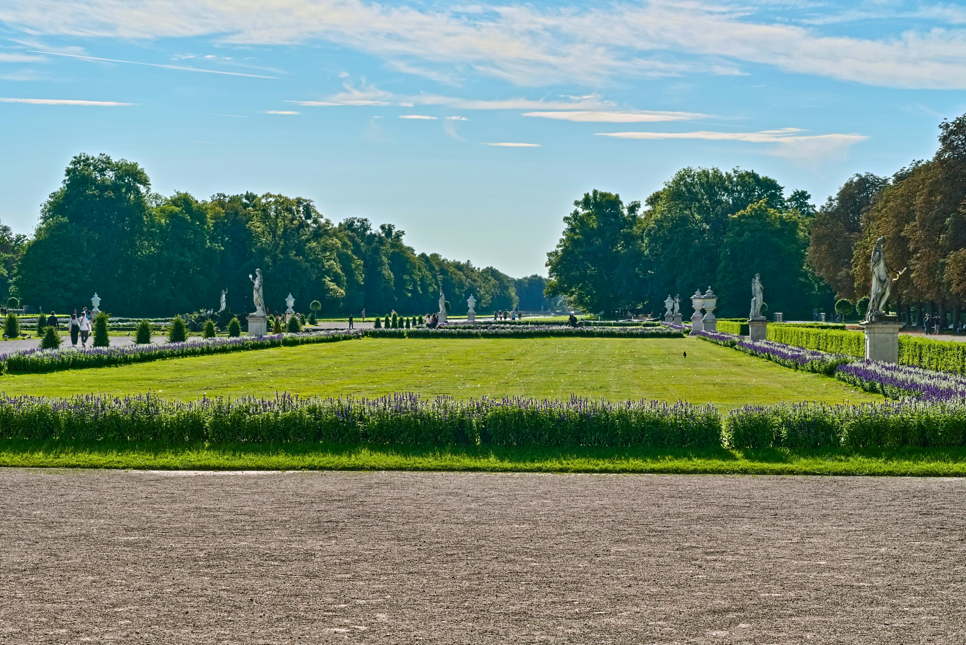 Manicured lawn and statues in a formal garden