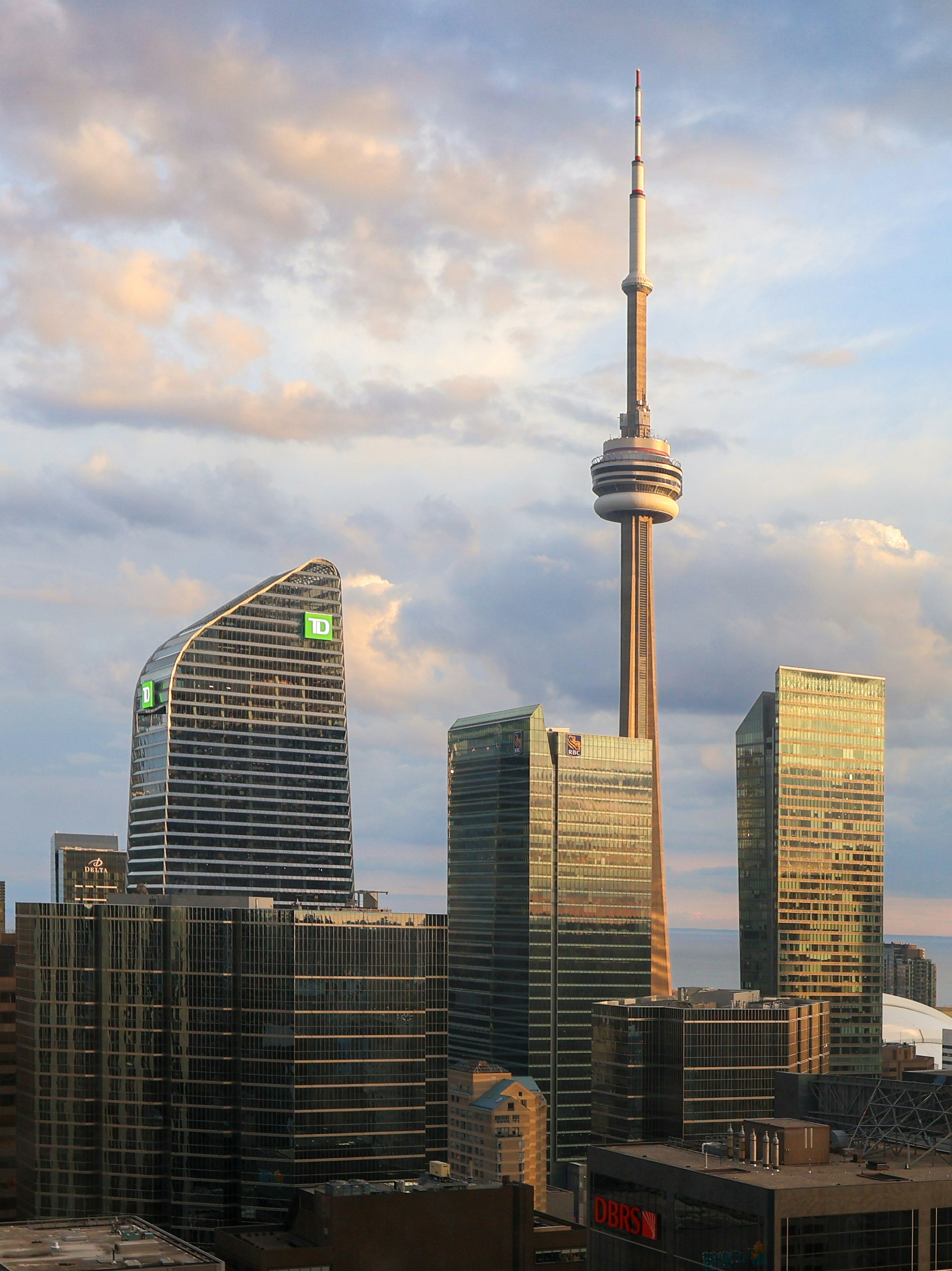 CN Tower in Toronto photographed at sunset. | Toronto skyline with cn tower and modern buildings