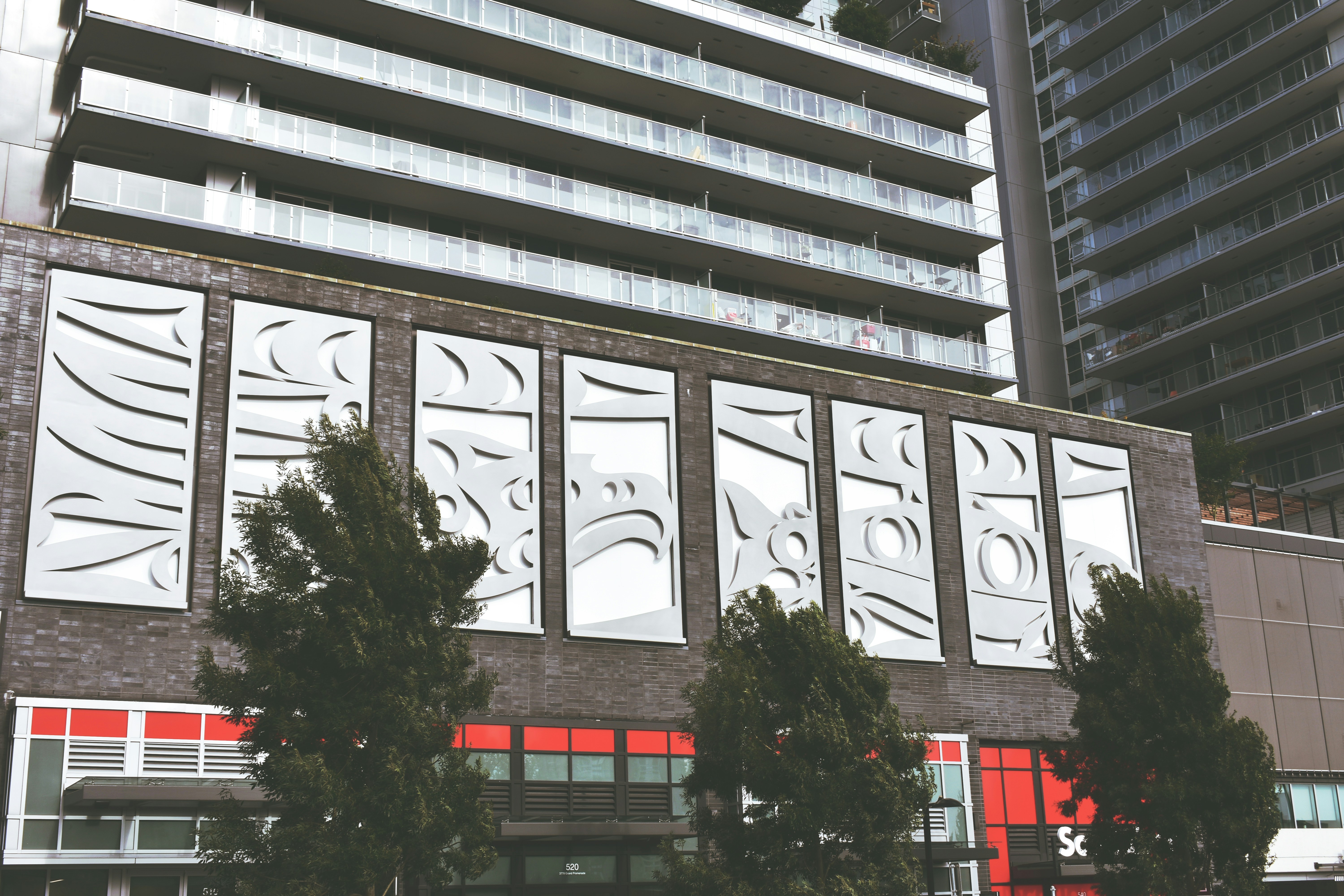 Modern building facade with abstract art panels