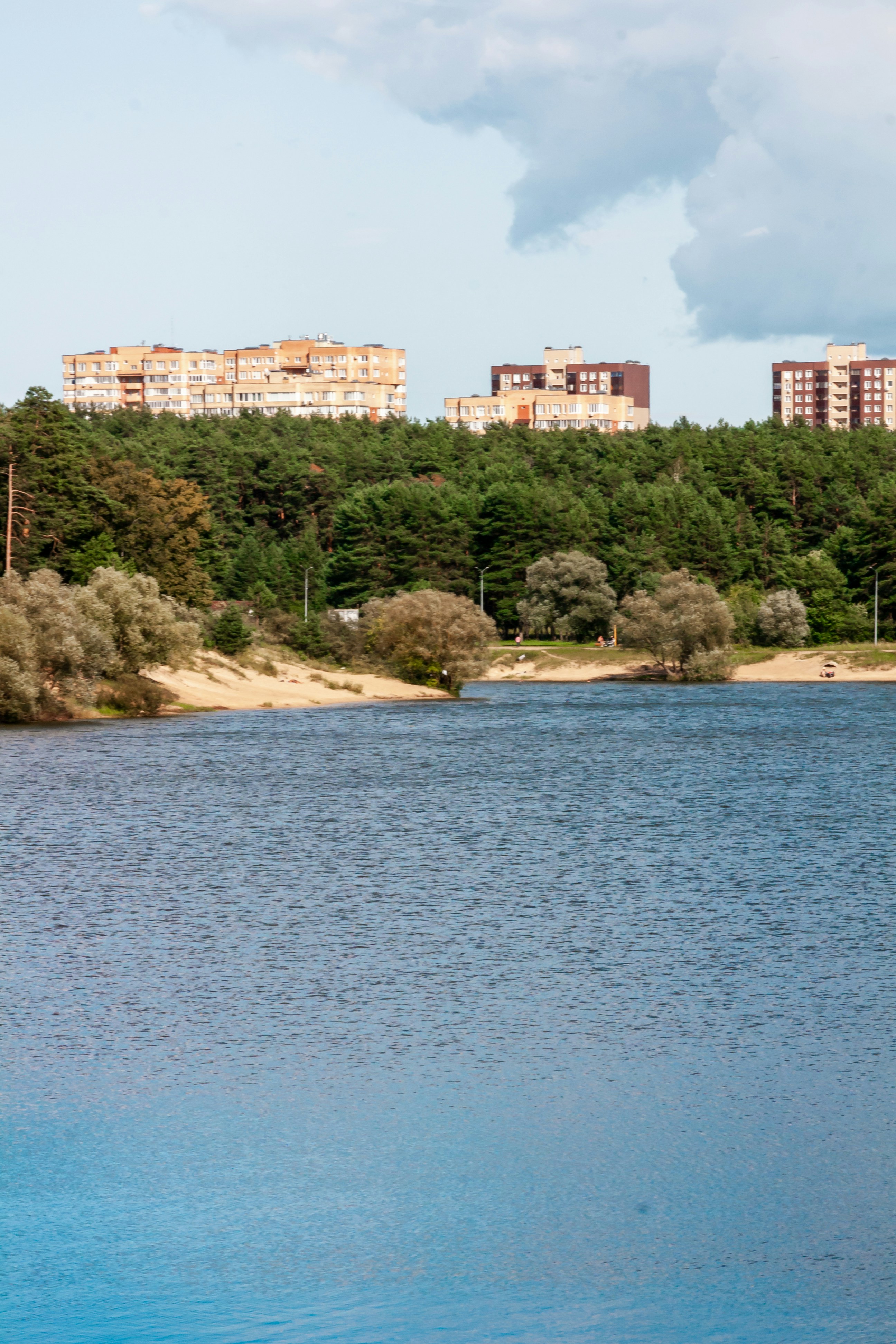Apartment buildings on a hill overlooking water