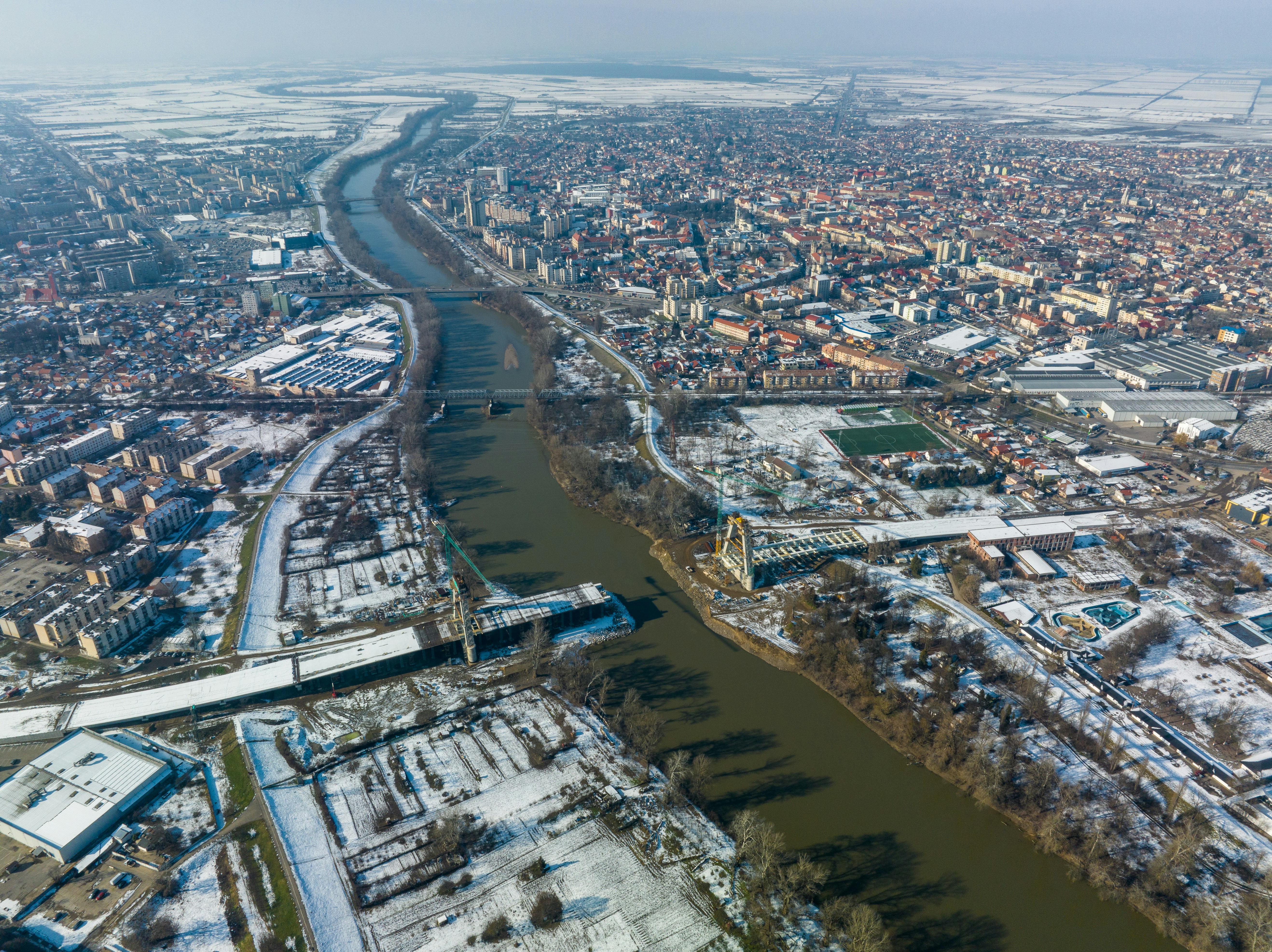 Aerial Tapestry: The Interplay of Urban Life and Nature