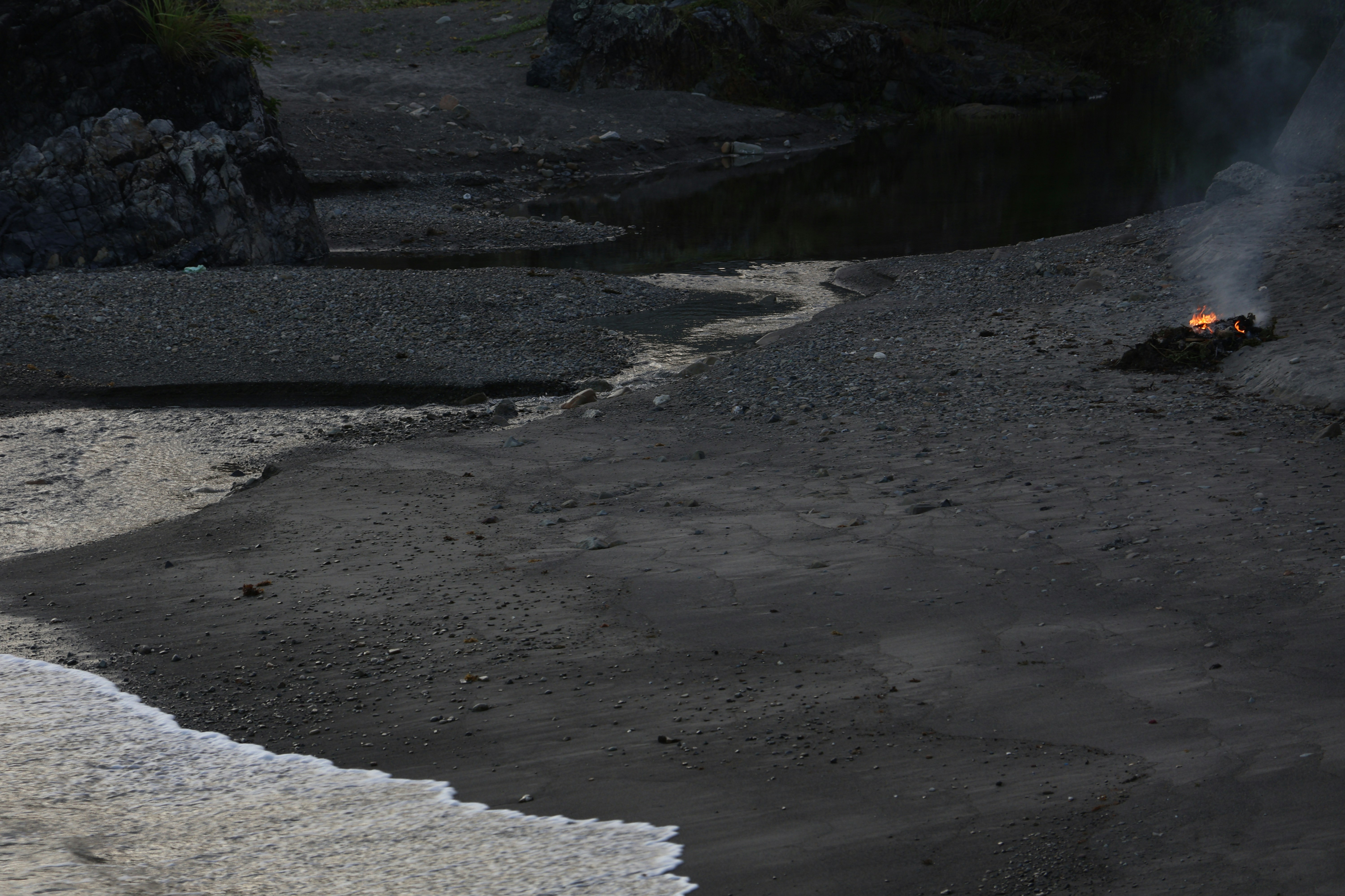 Embers on the Shoreline: A Quiet Blaze