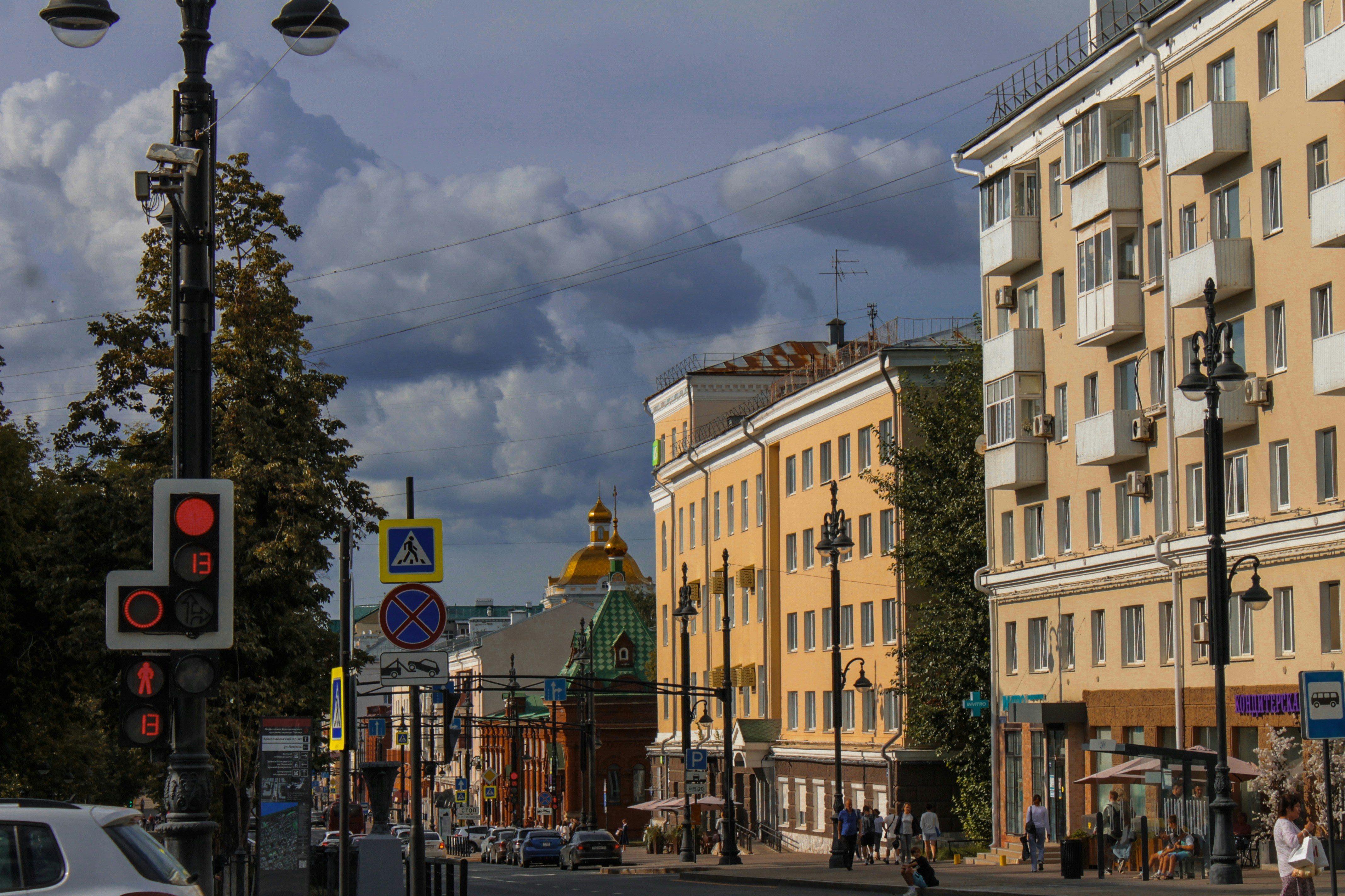 City street with buildings and traffic lights.