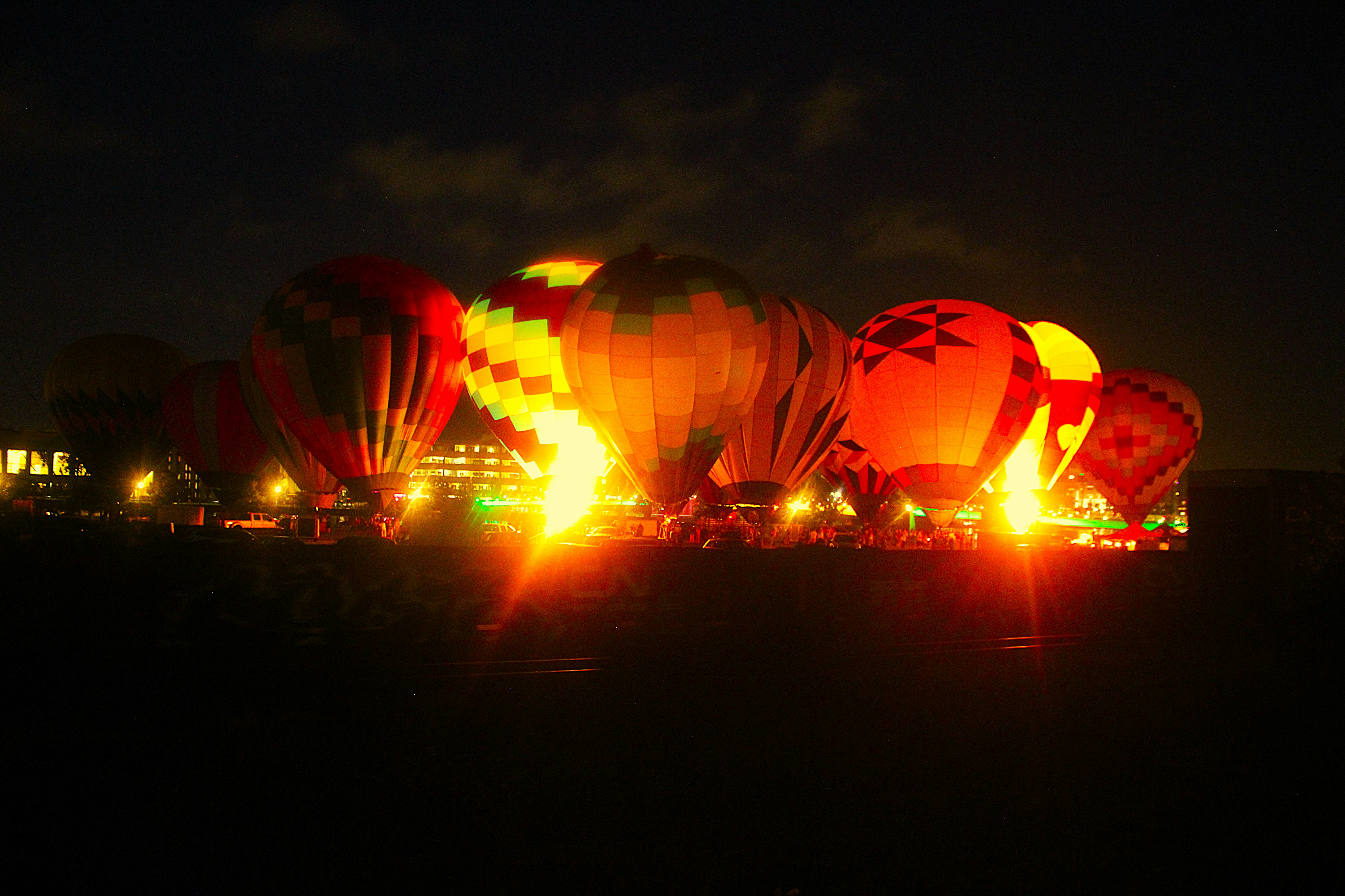 Hot air balloons illuminated at night festival