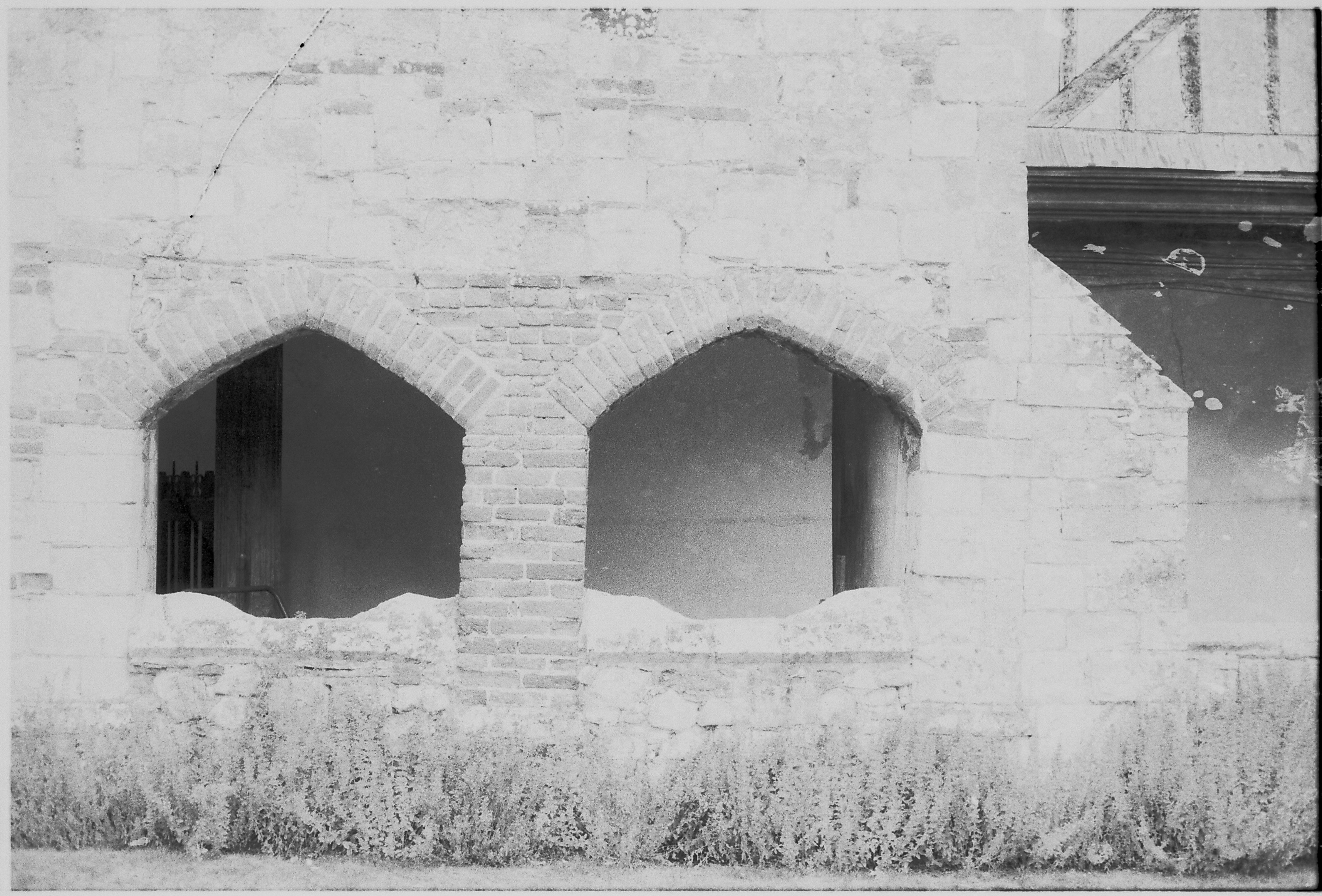 Ruined brick building with arched openings