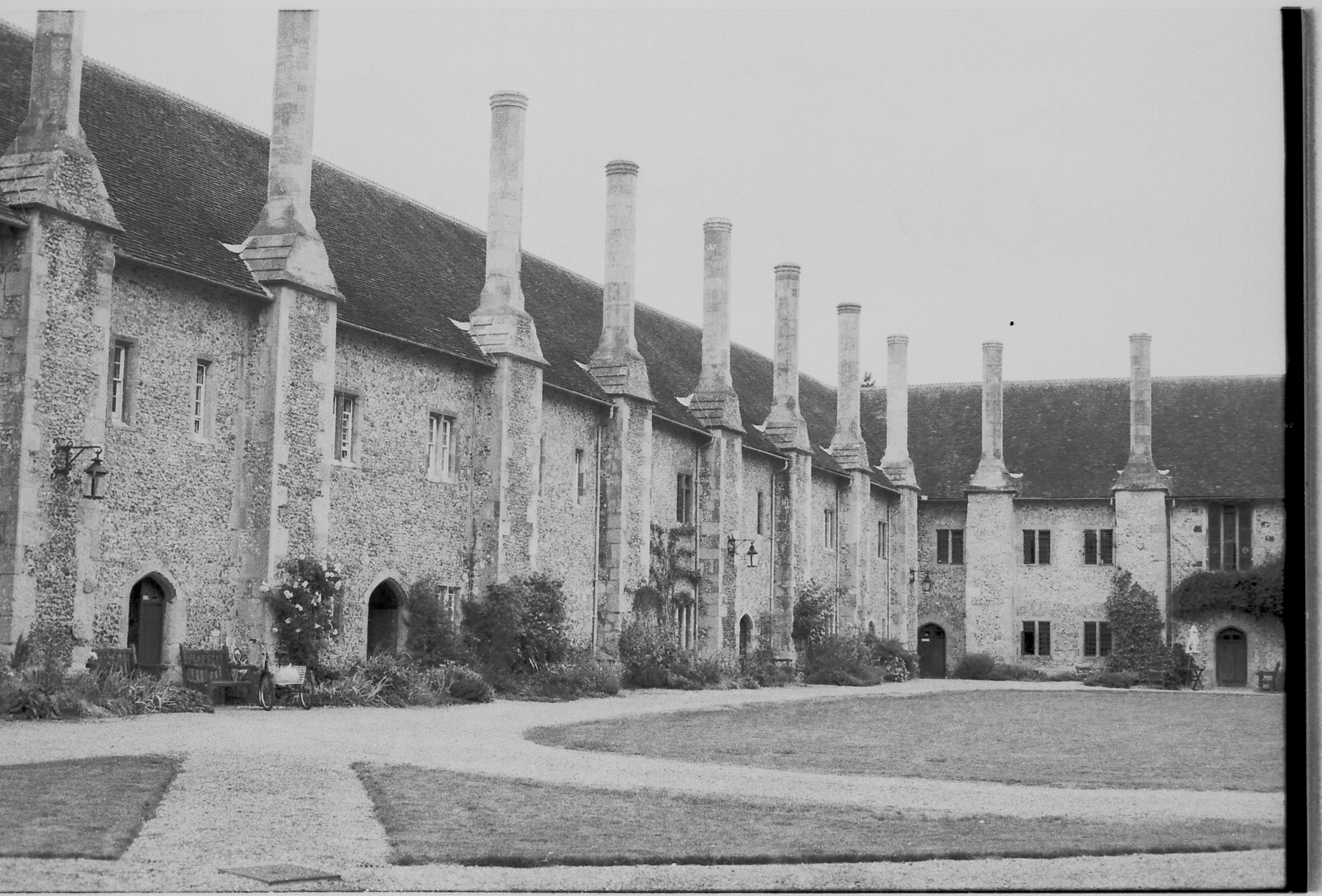 Historic stone building with many chimneys and courtyard. photo – Free ...