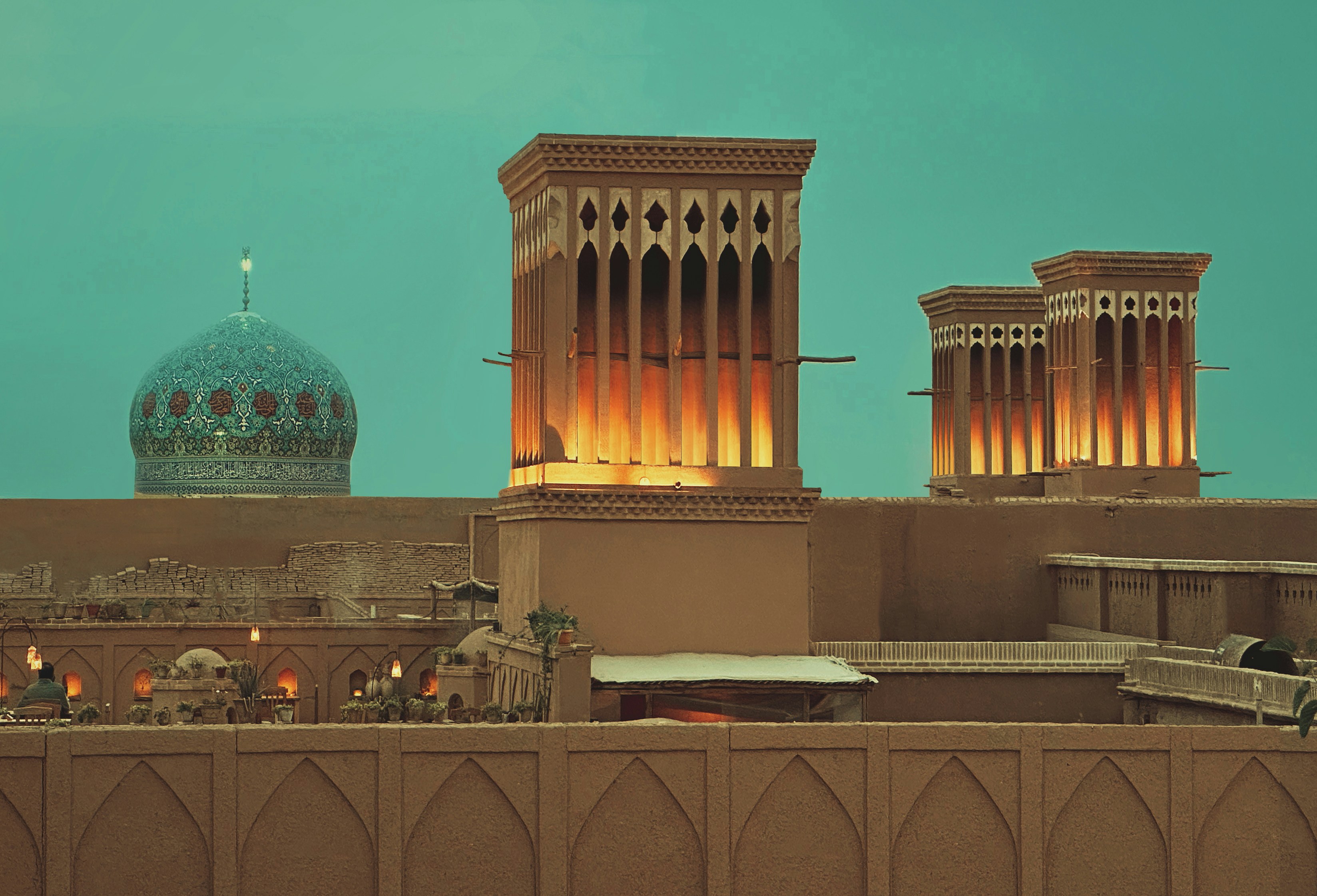 Windcatchers in Yazd, Iran | Traditional windcatchers and dome against teal sky