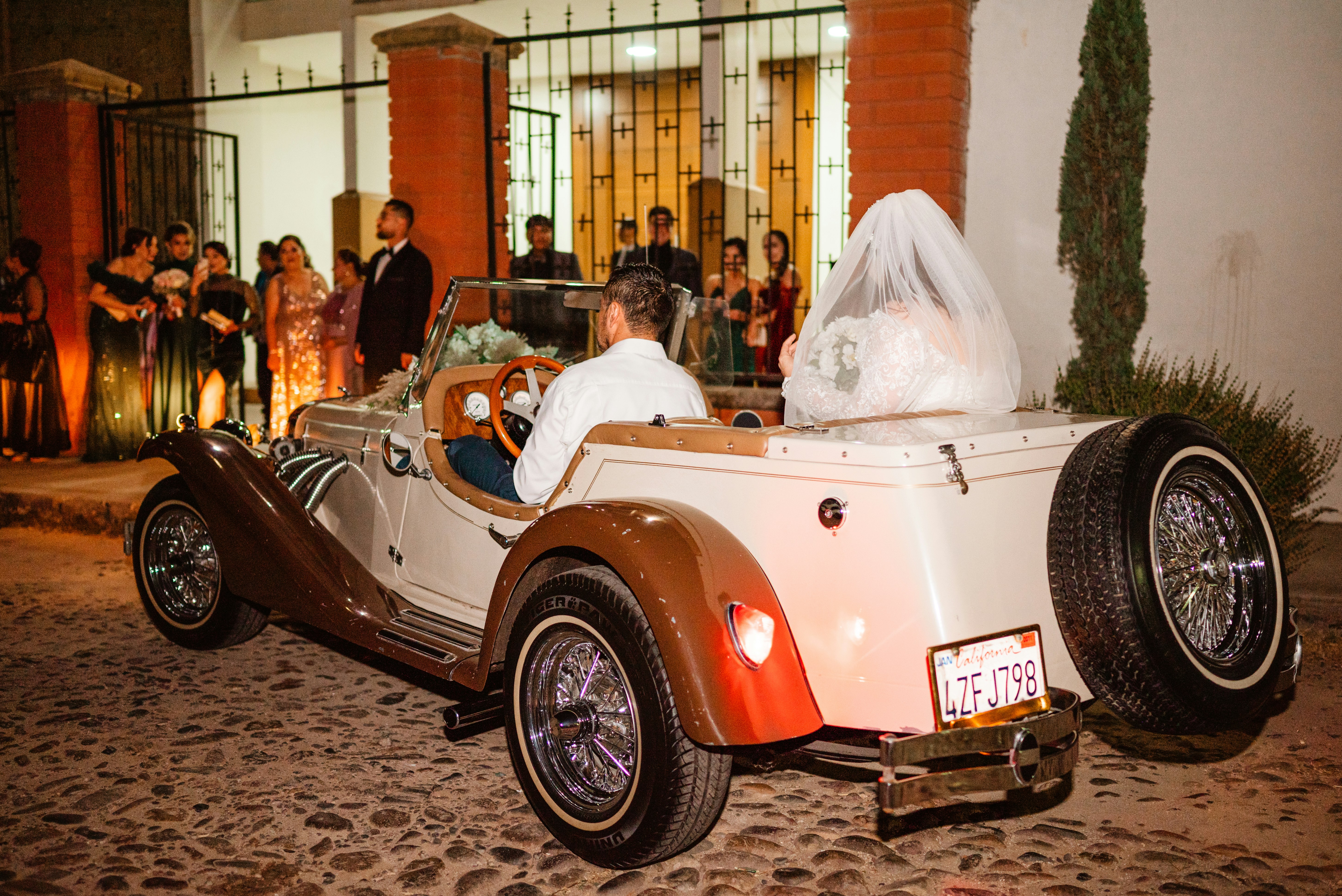 Veil, Vintage Roadster, and Night-Cobblestones: A Wedding Entrance