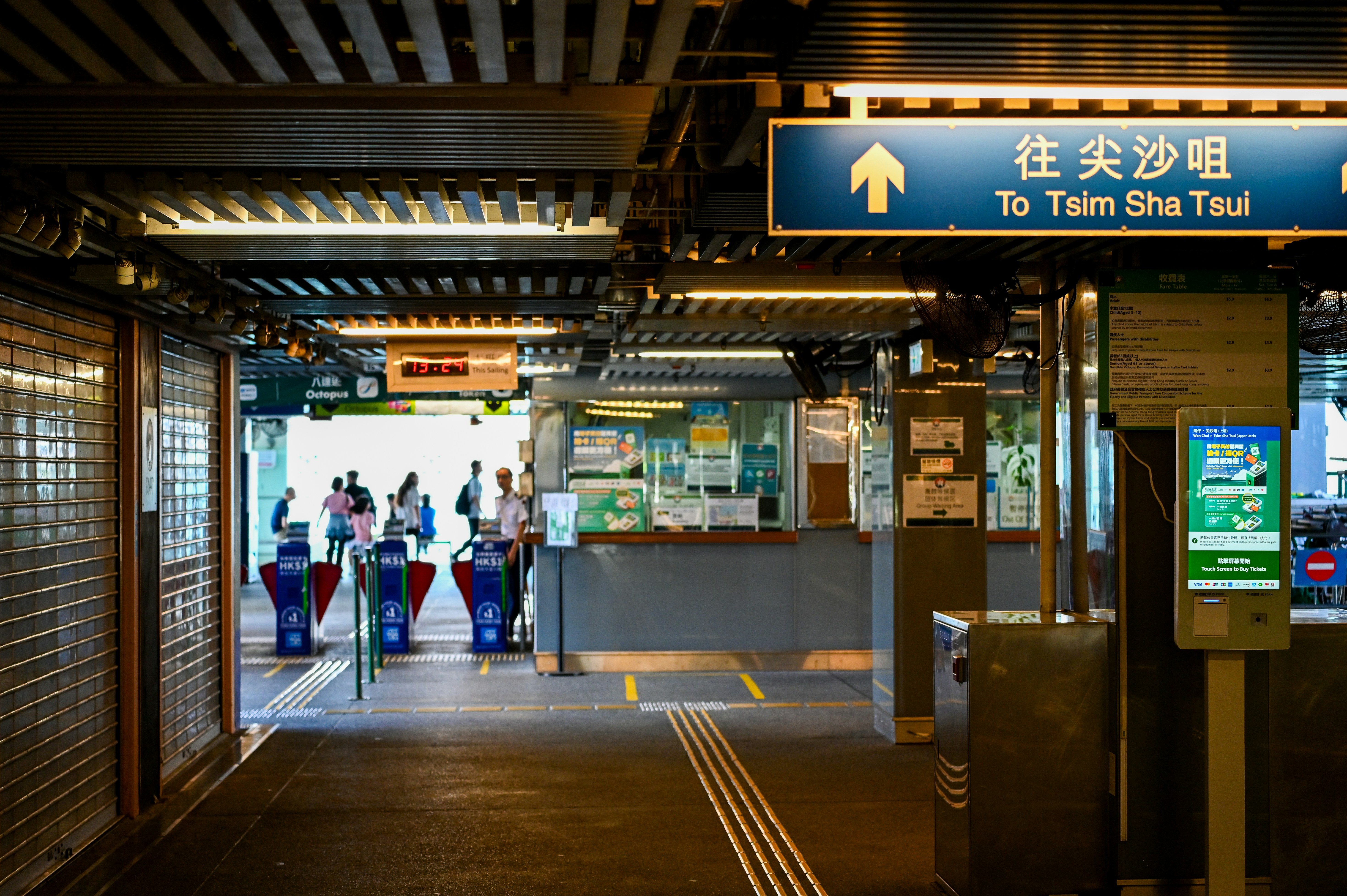 Blue Signpost Leading to Tsim Sha Tsui in a Hong Kong Transit Hall